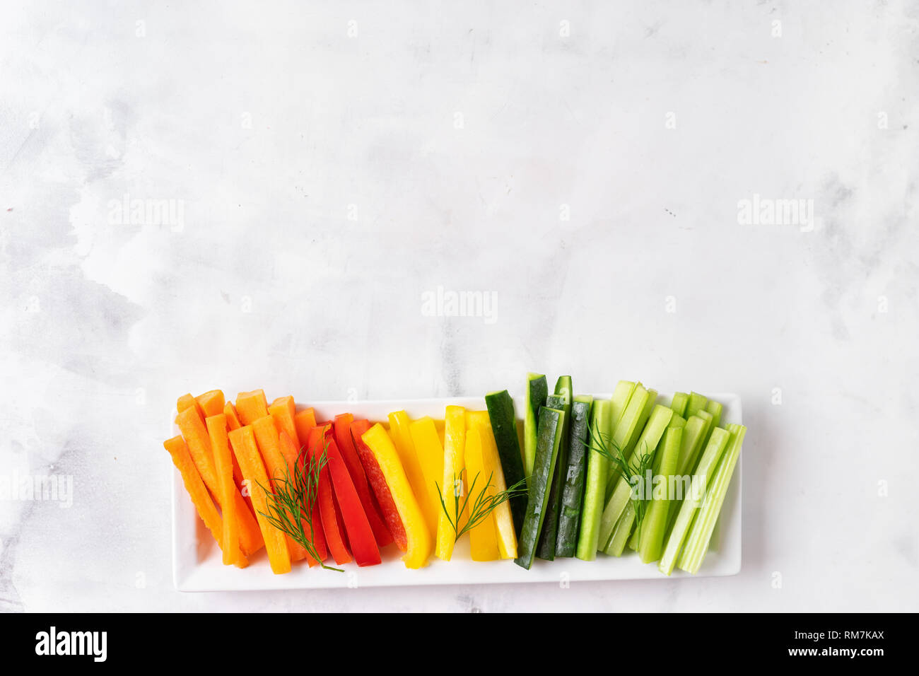 Colorful vegetable sticks in long plate. Top view Stock Photo - Alamy