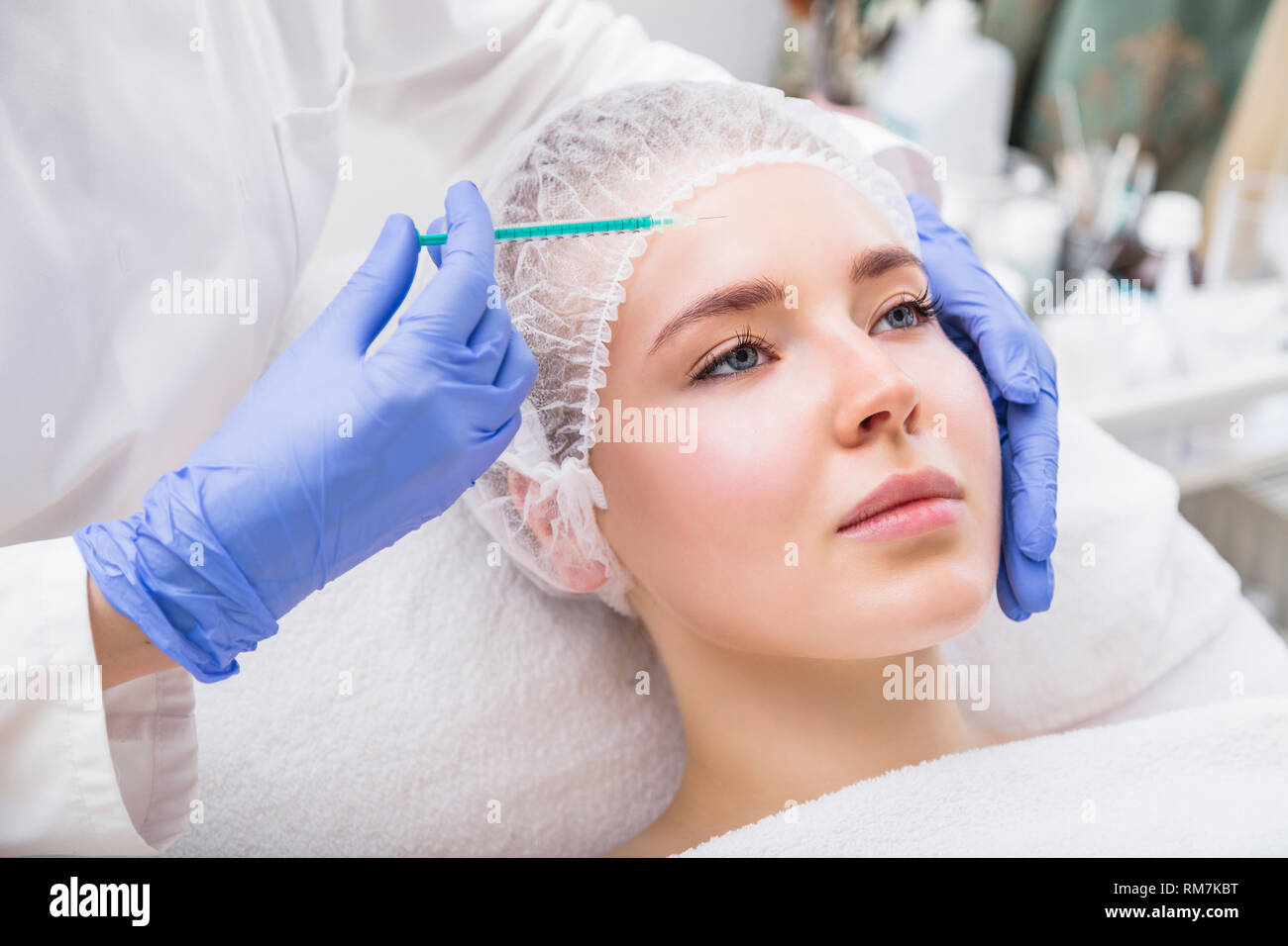 Young woman patient receiving plastic surgery injection Stock Photo - Alamy