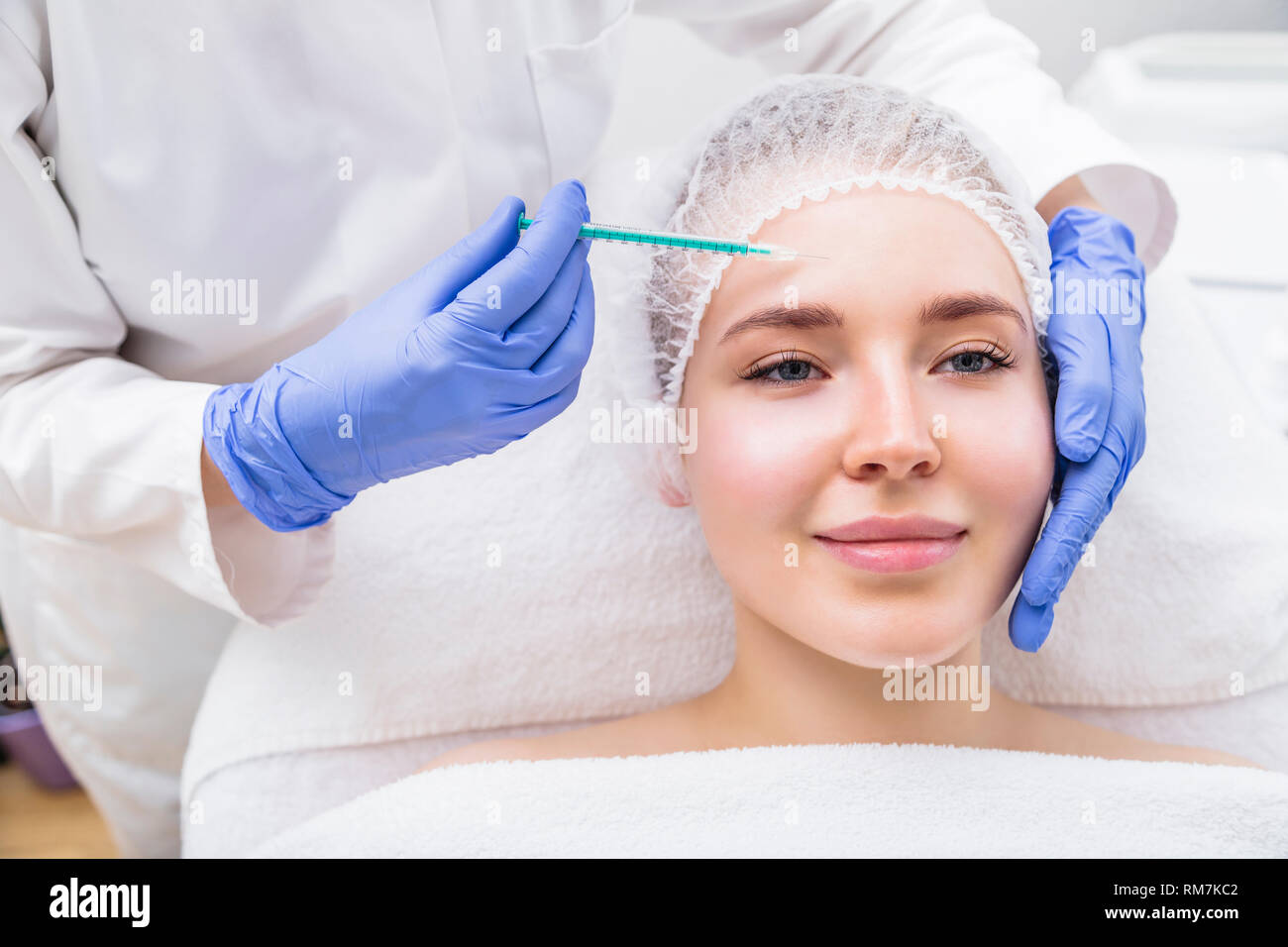 Young woman patient receiving plastic surgery injection Stock Photo - Alamy