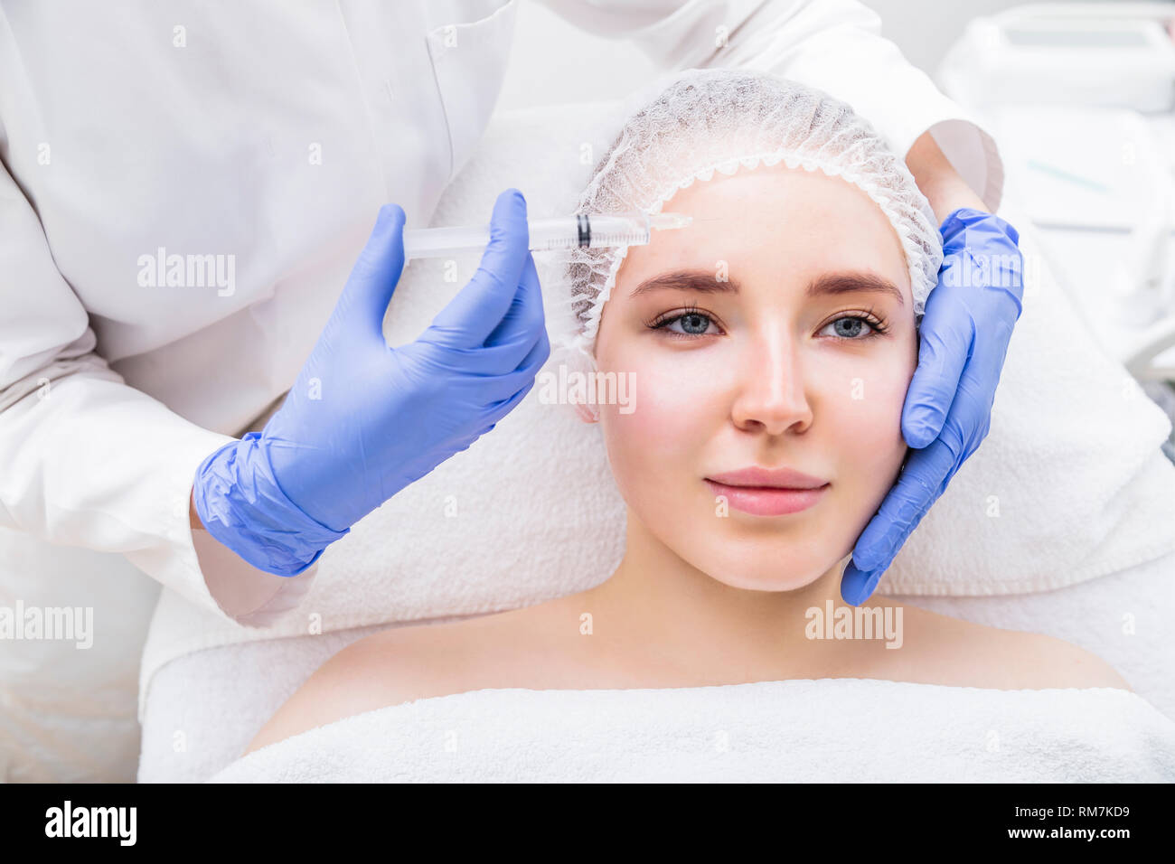 Young woman patient receiving plastic surgery injection Stock Photo - Alamy