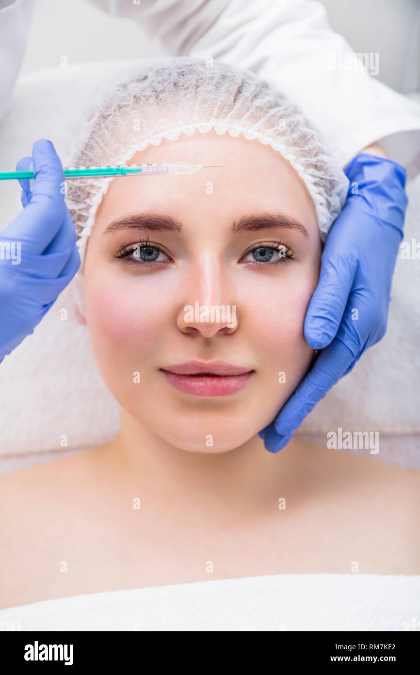 Young woman patient receiving plastic surgery injection Stock Photo - Alamy