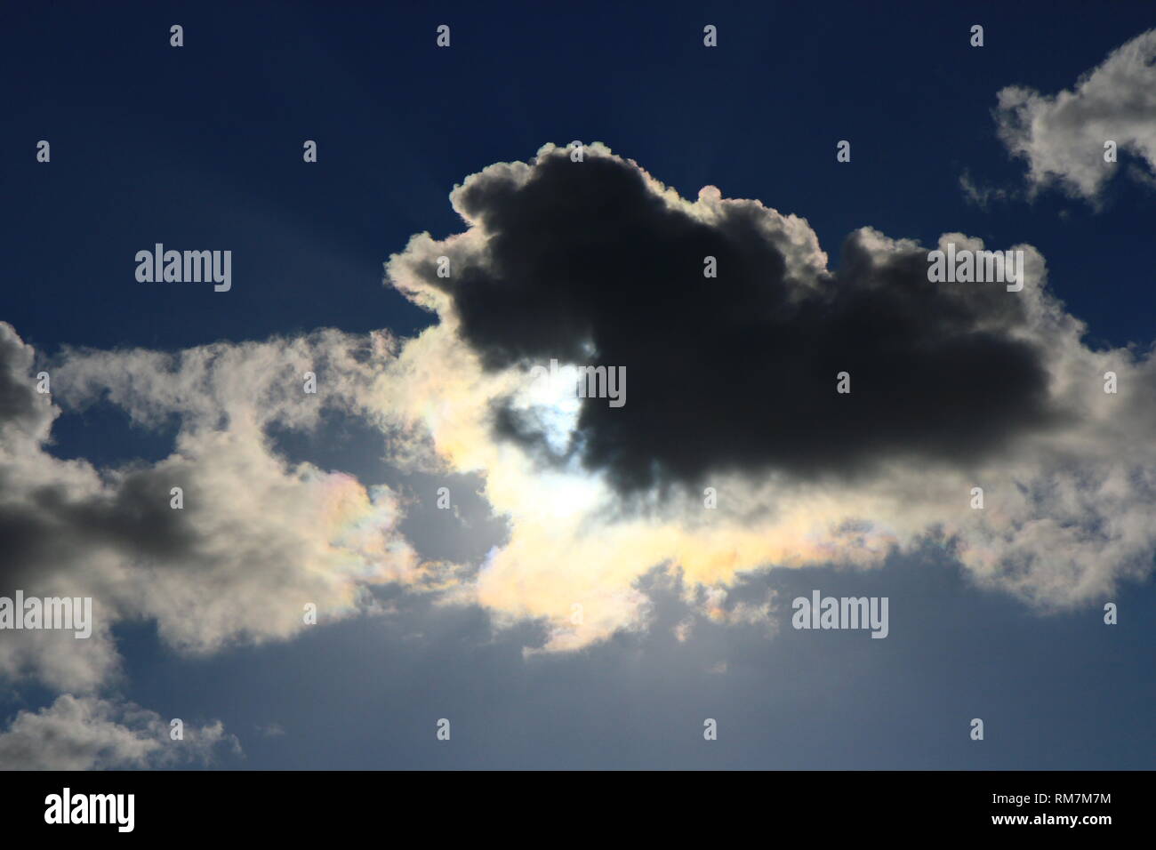 sun behind a cloud Stock Photo - Alamy