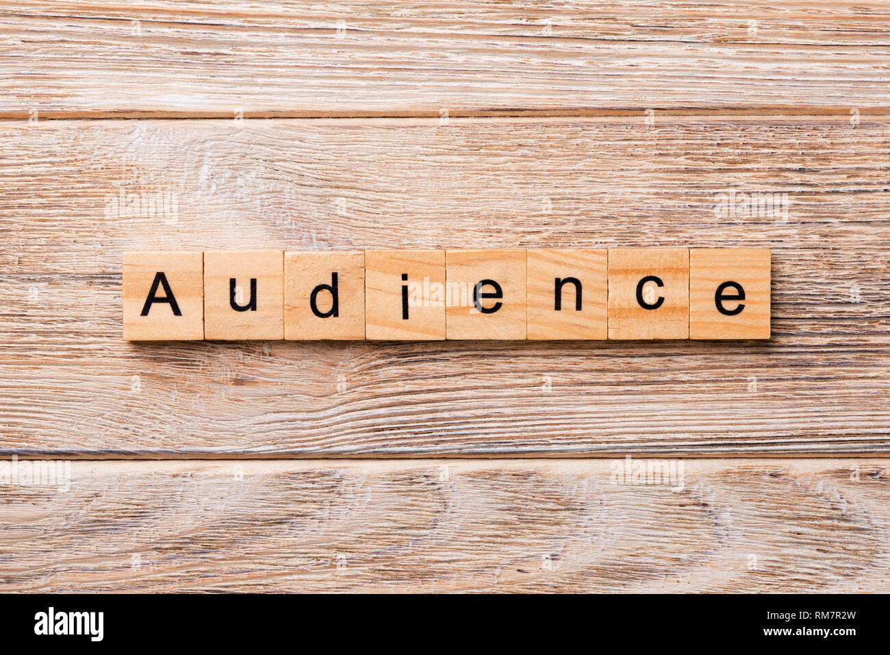 AUDIENCE word written on wood block. AUDIENCE text on wooden table for ...