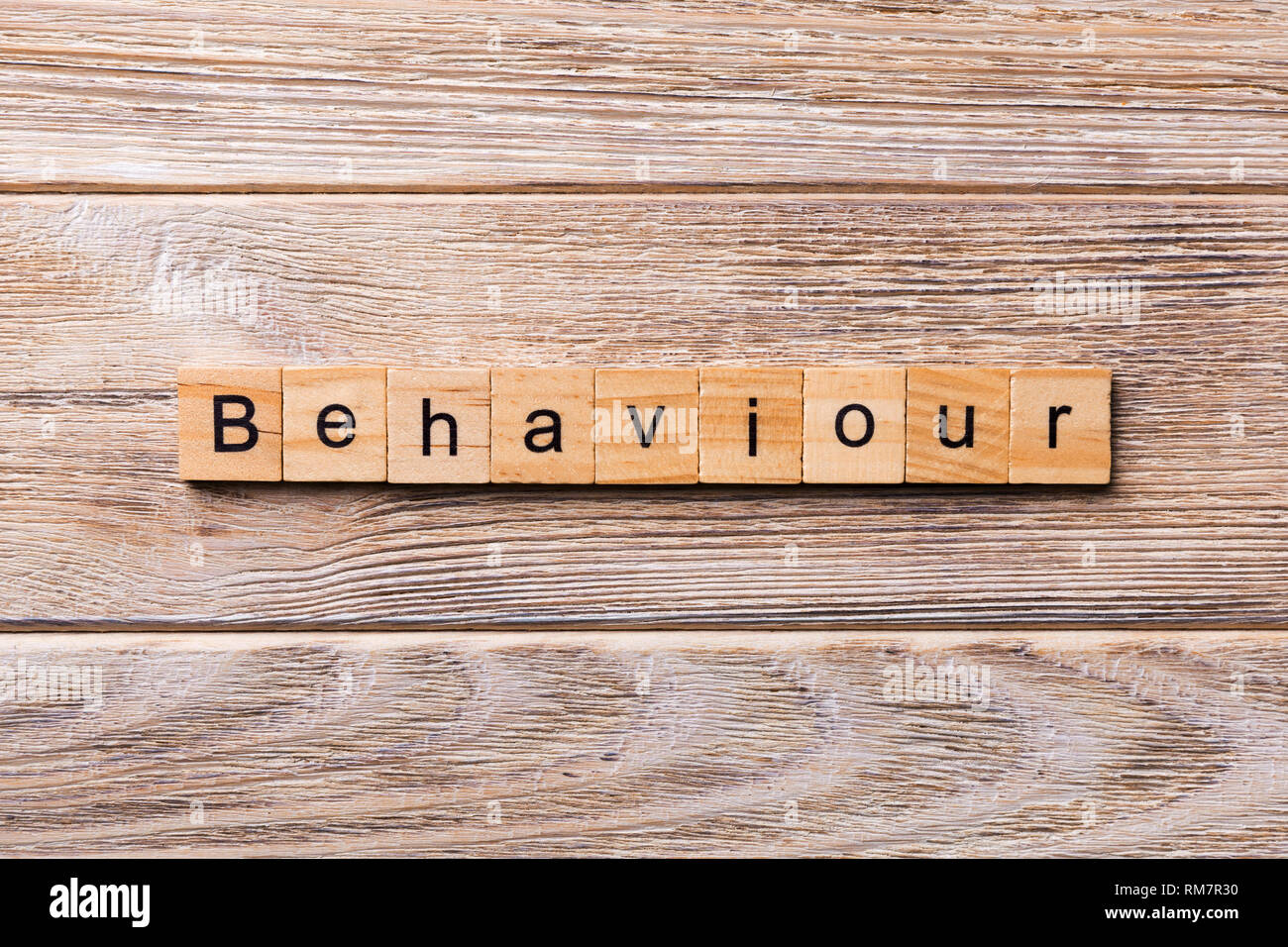 BEHAVIOR word written on wood block. BEHAVIOR text on wooden table for ...
