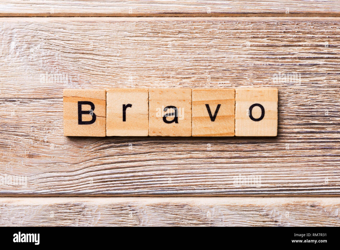 BRAVO word written on wood block. BRAVO text on wooden table for your ...
