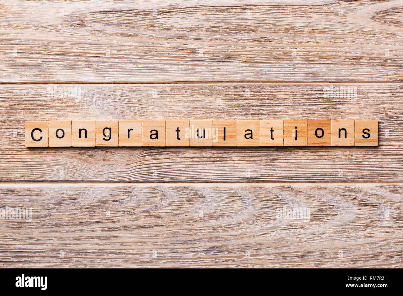 congratulations word written on wood block. congratulations text on ...