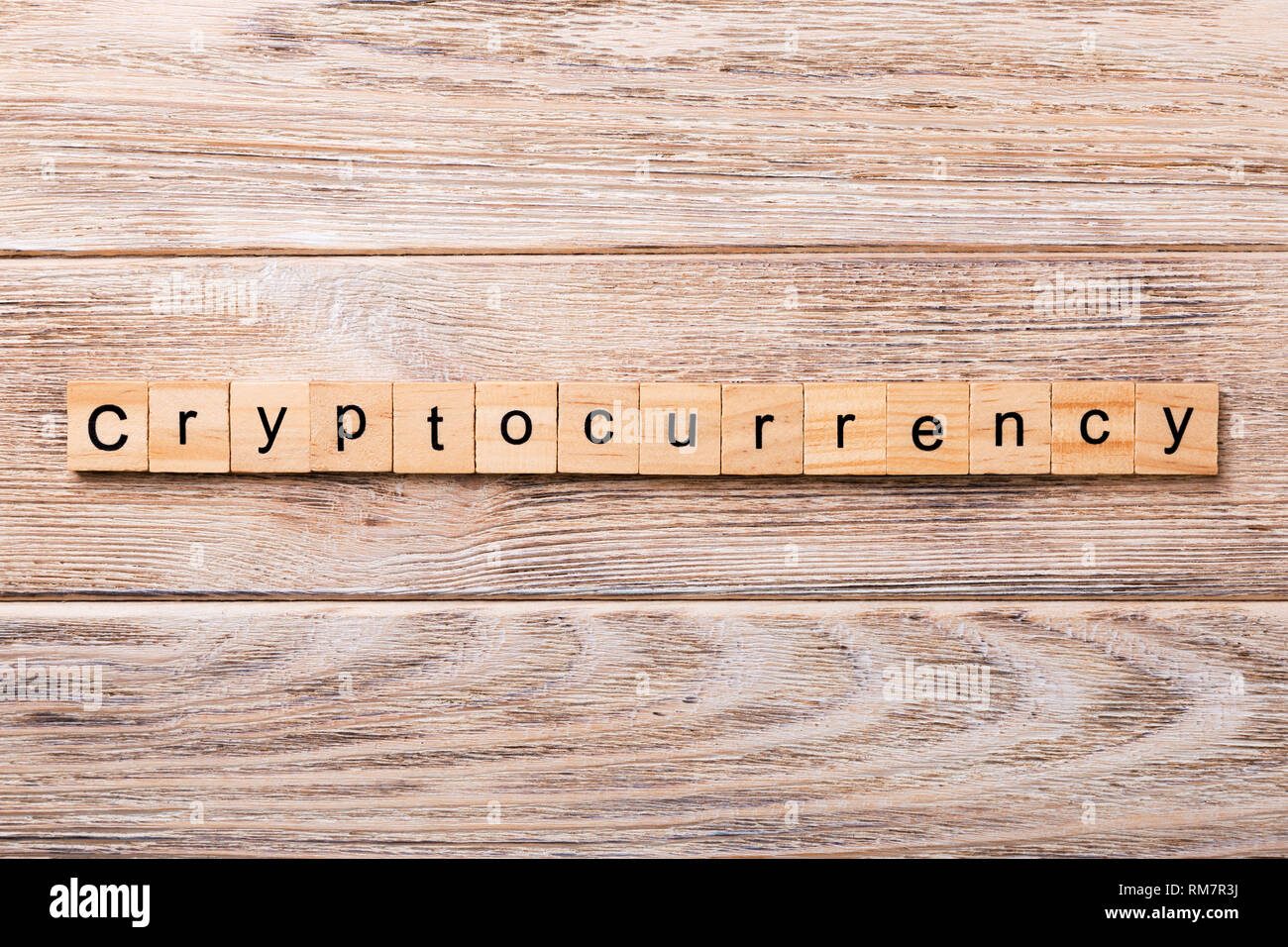 Cryptocurrency word written on wood block. Cryptocurrency text on ...