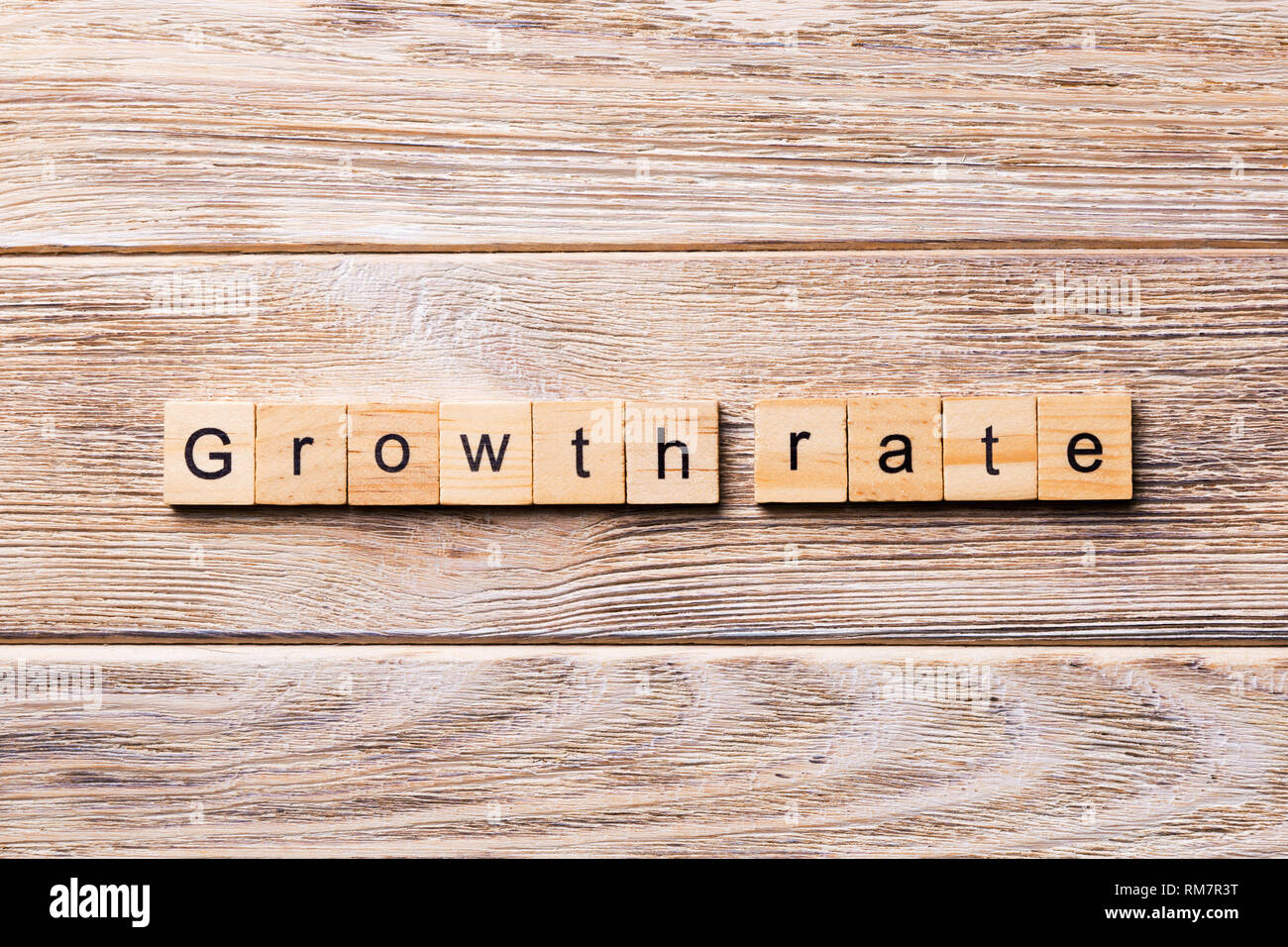 growth rate word written on wood block. growth rate text on wooden ...