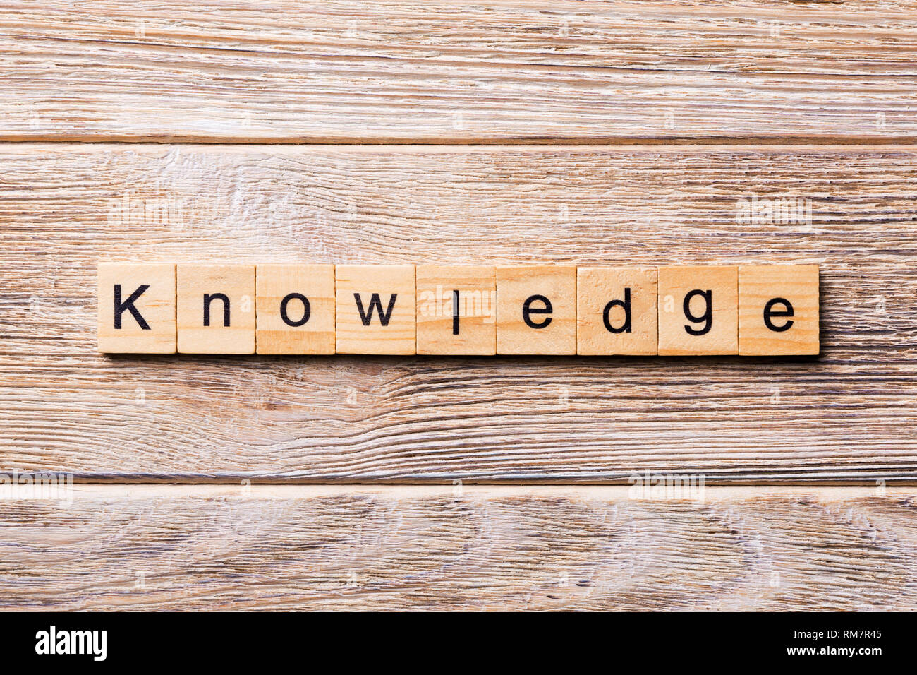 Knowledge word written on wood block. Knowledge text on wooden table ...