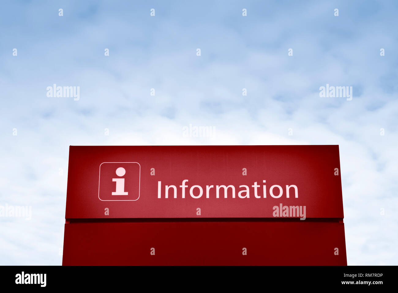 Red information sign against a blue sky - concept image Stock Photo - Alamy