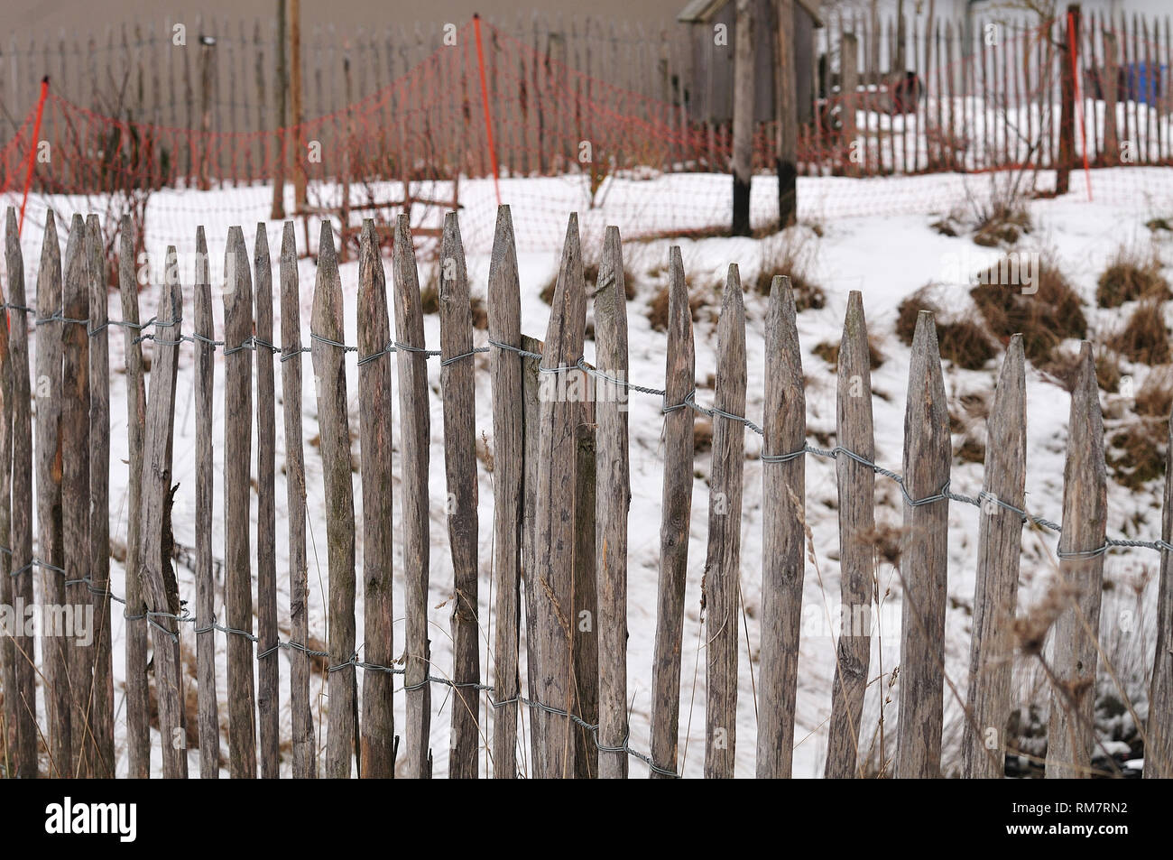 simple wooden fence in a village constructed with slats linked with ...