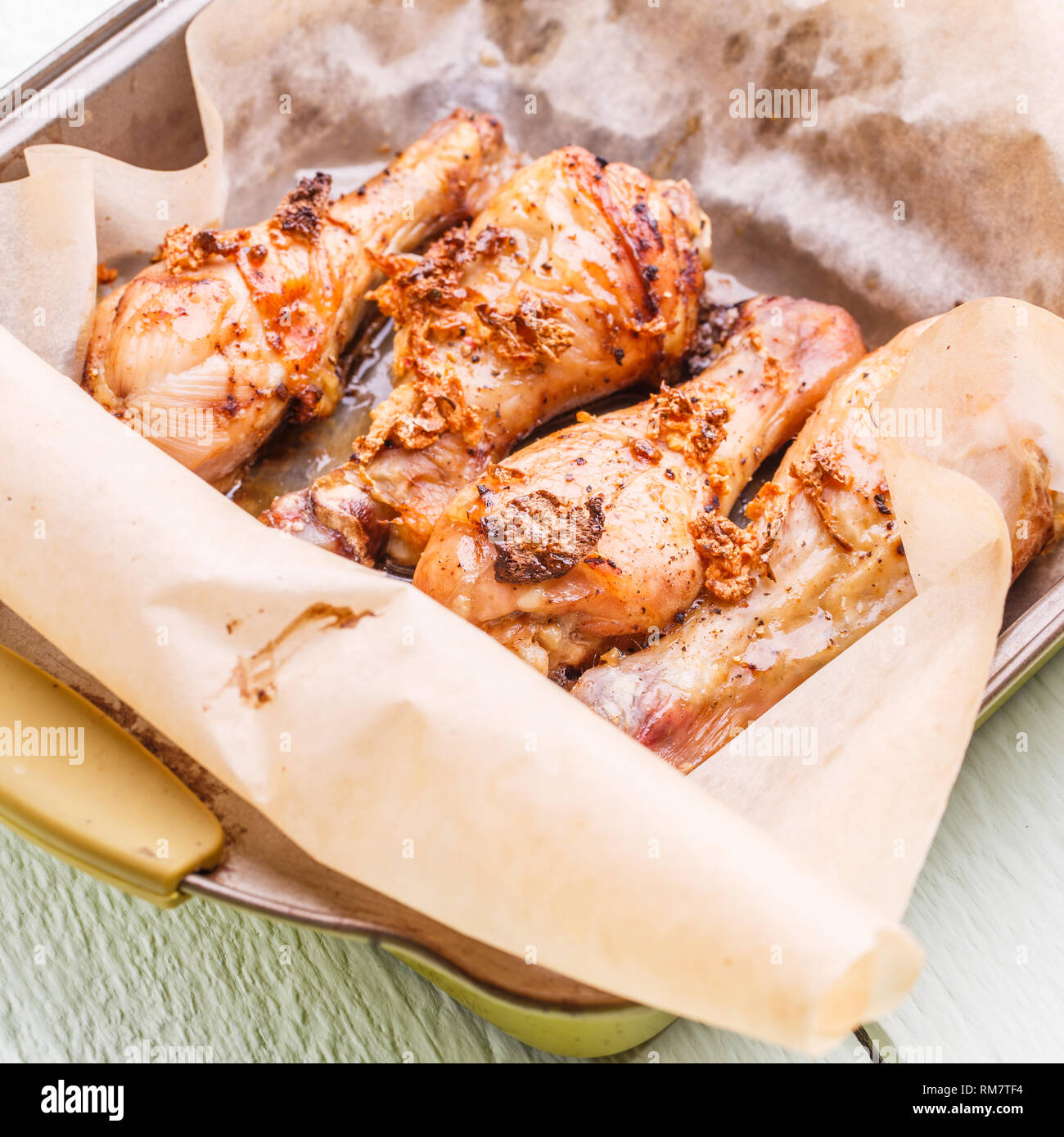 Chicken drumsticks on wax paper Stock Photo - Alamy