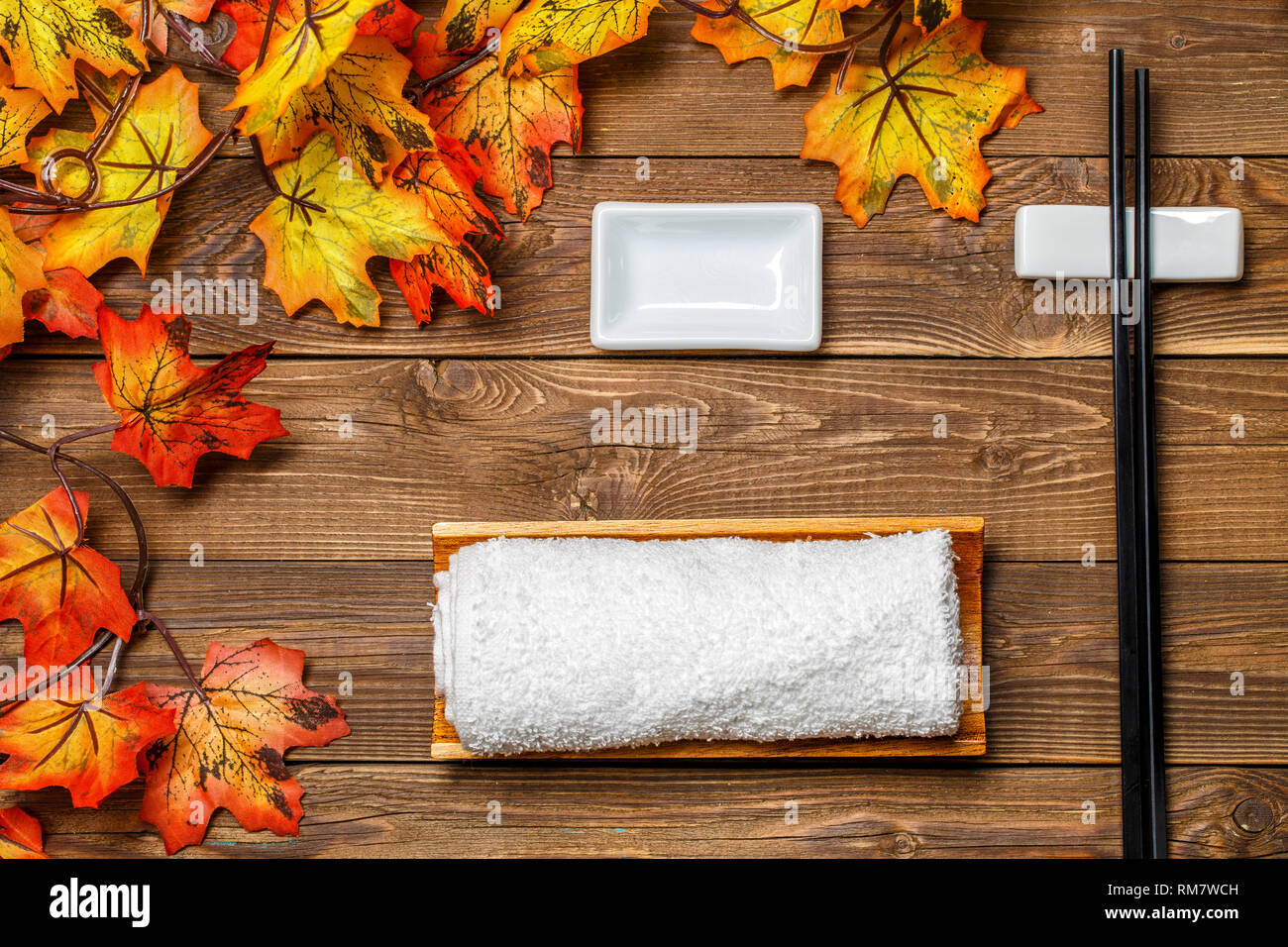 Wooden table with chopsticks, towel Stock Photo - Alamy