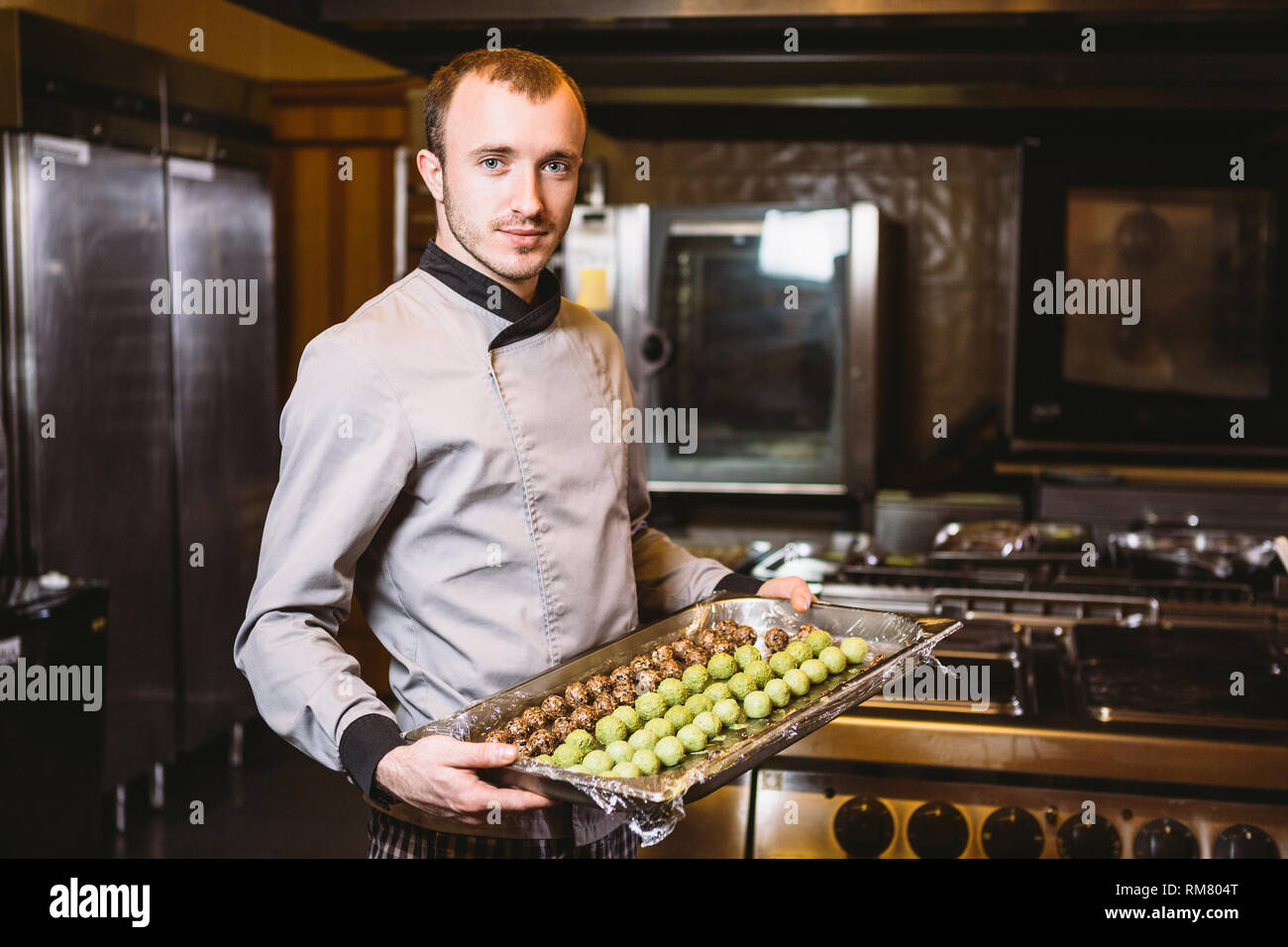 Subject profession and cooking pastry. Young caucasian male pastry chef ...