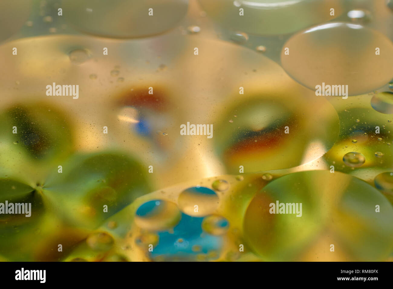 floating in the water abstract colorful, yellow oil drops Stock Photo ...