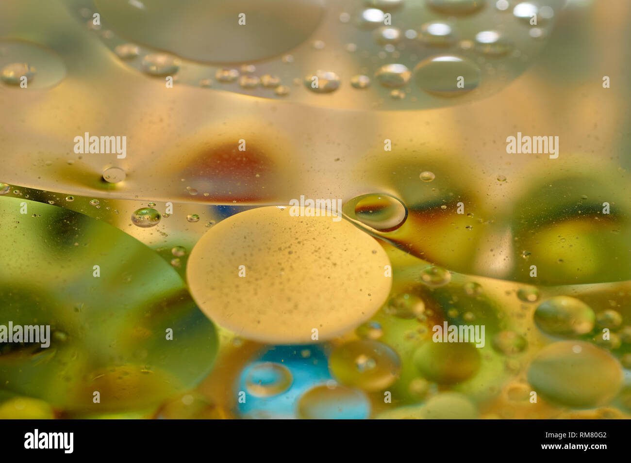 floating in the water abstract colorful, yellow oil drops Stock Photo ...
