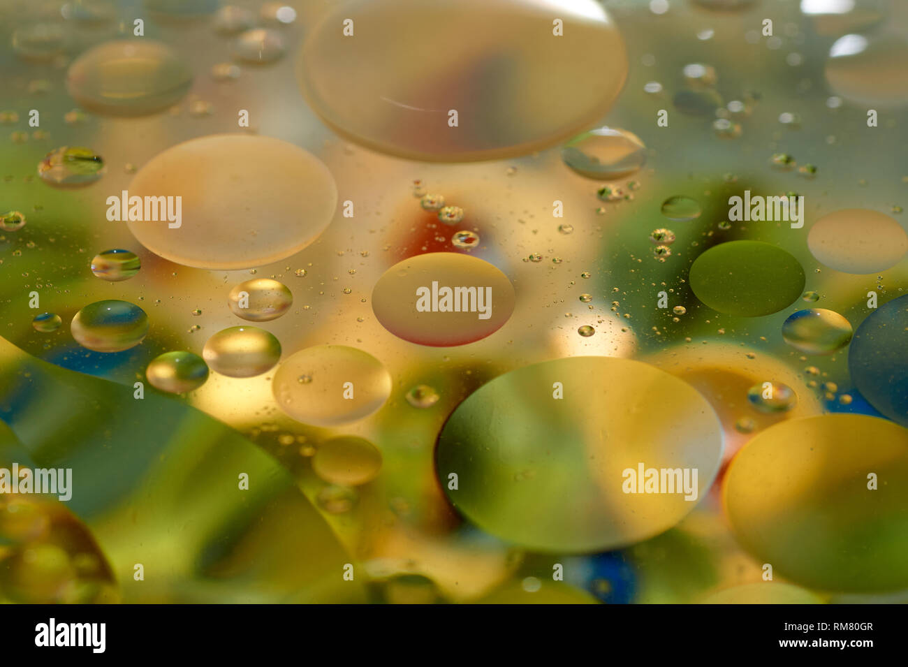 floating in the water abstract colorful, yellow oil drops Stock Photo ...
