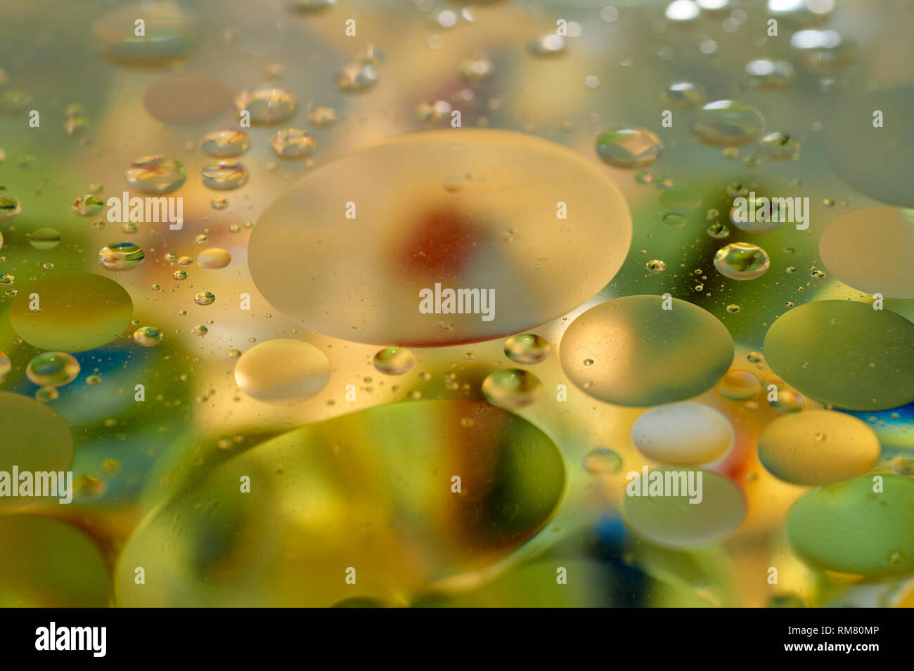 floating in the water abstract colorful, yellow oil drops Stock Photo ...