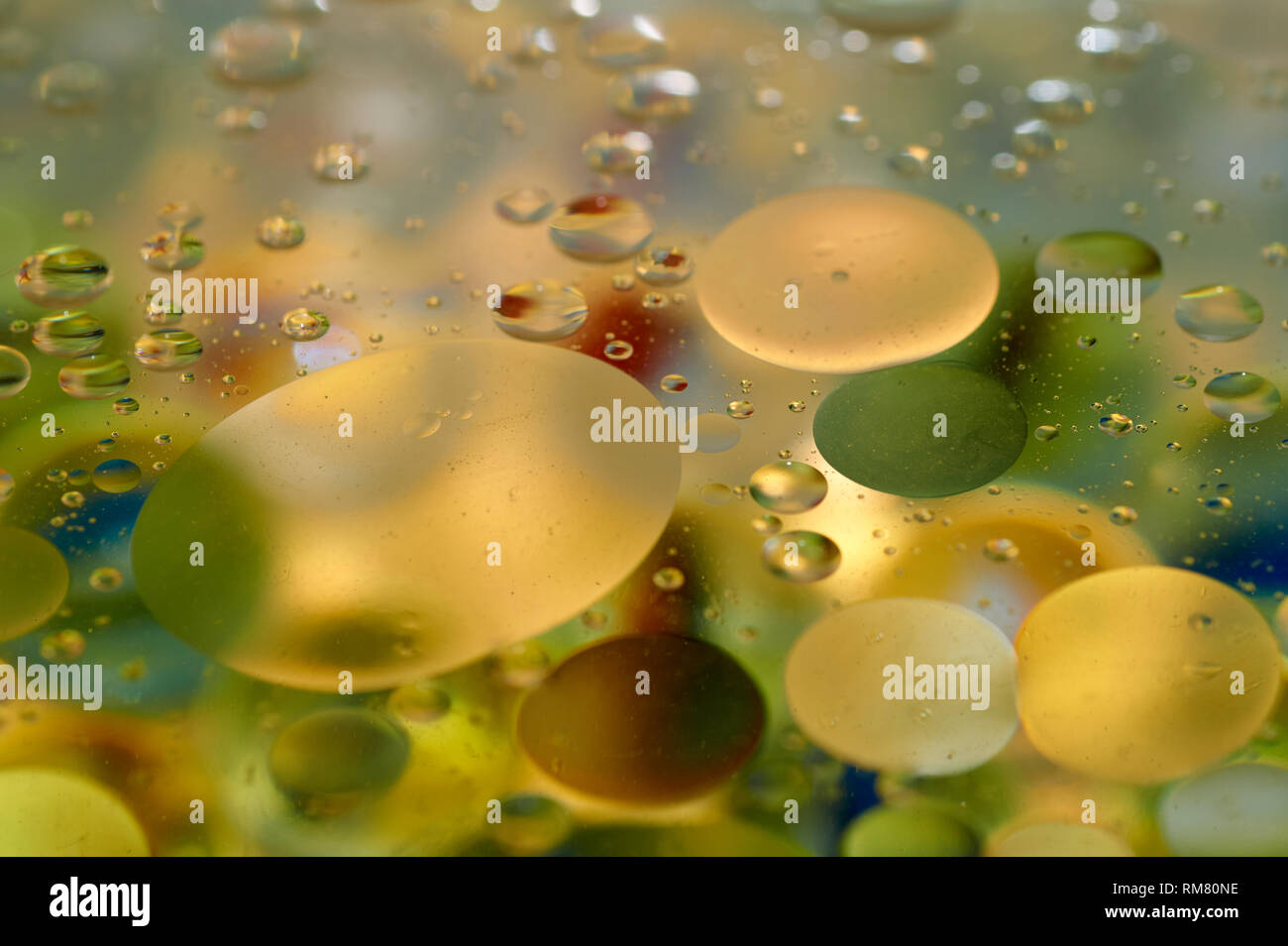 floating in the water abstract colorful, yellow oil drops Stock Photo ...