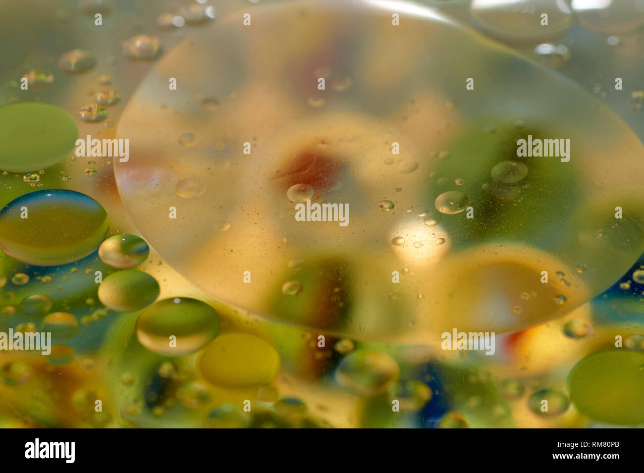 floating in the water abstract colorful, yellow oil drops Stock Photo ...