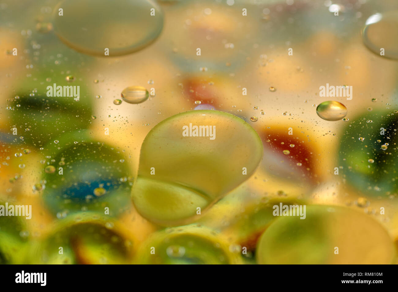 floating in the water abstract colorful, yellow oil drops Stock Photo ...