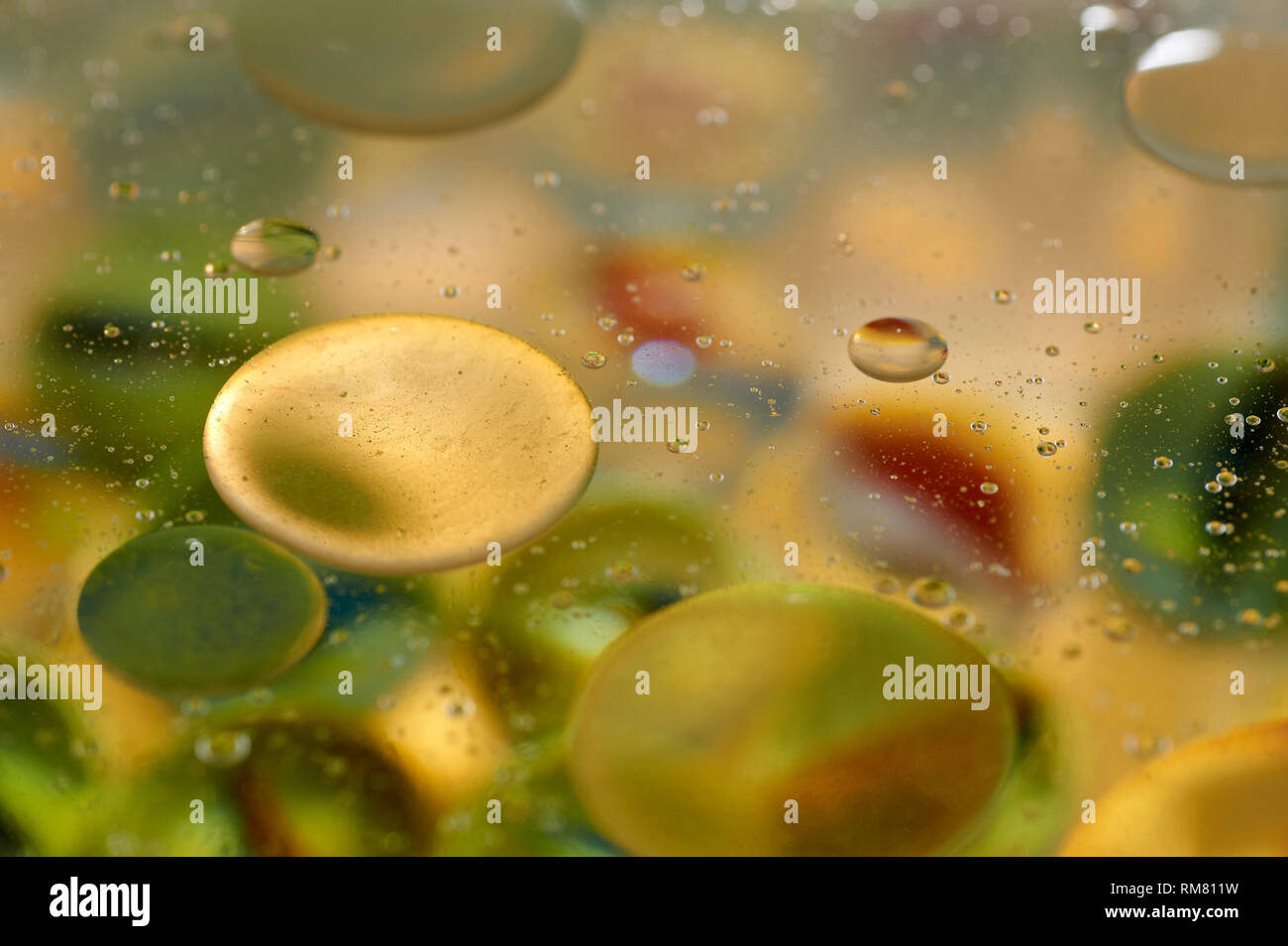 floating in the water abstract colorful, yellow oil drops Stock Photo ...