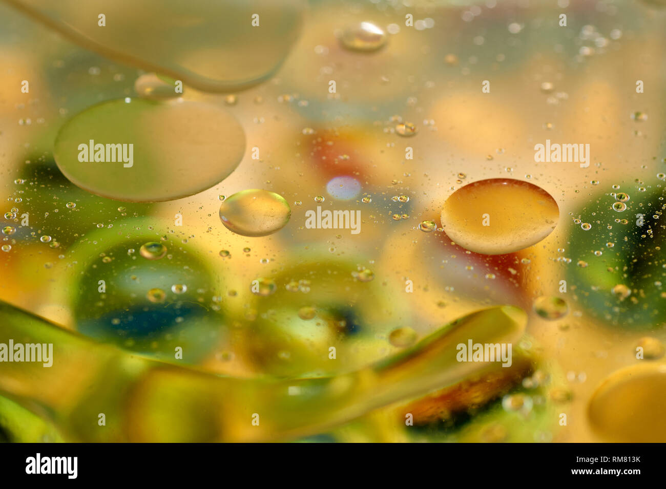 floating in the water abstract colorful, yellow oil drops Stock Photo ...