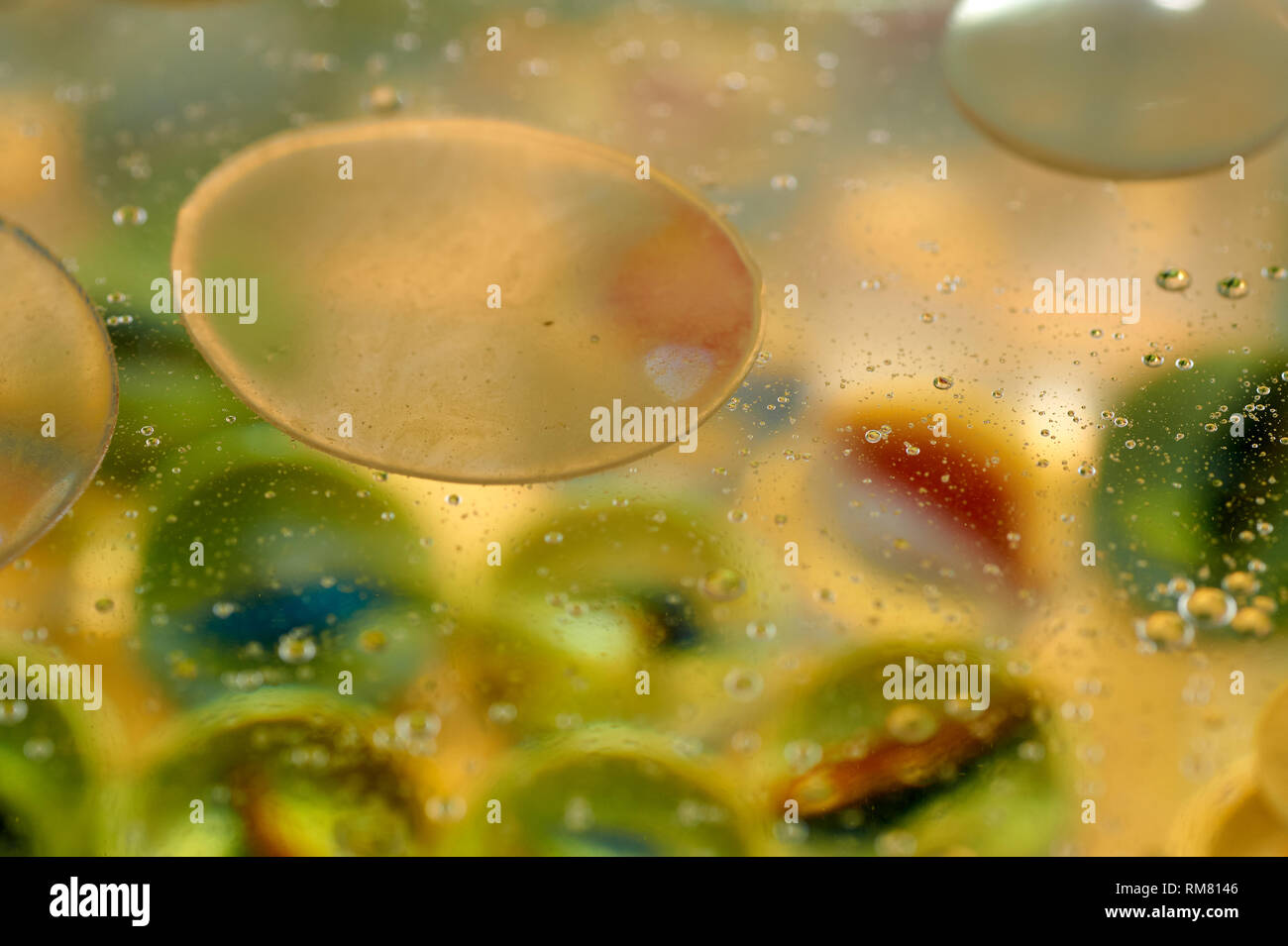 floating in the water abstract colorful, yellow oil drops Stock Photo ...