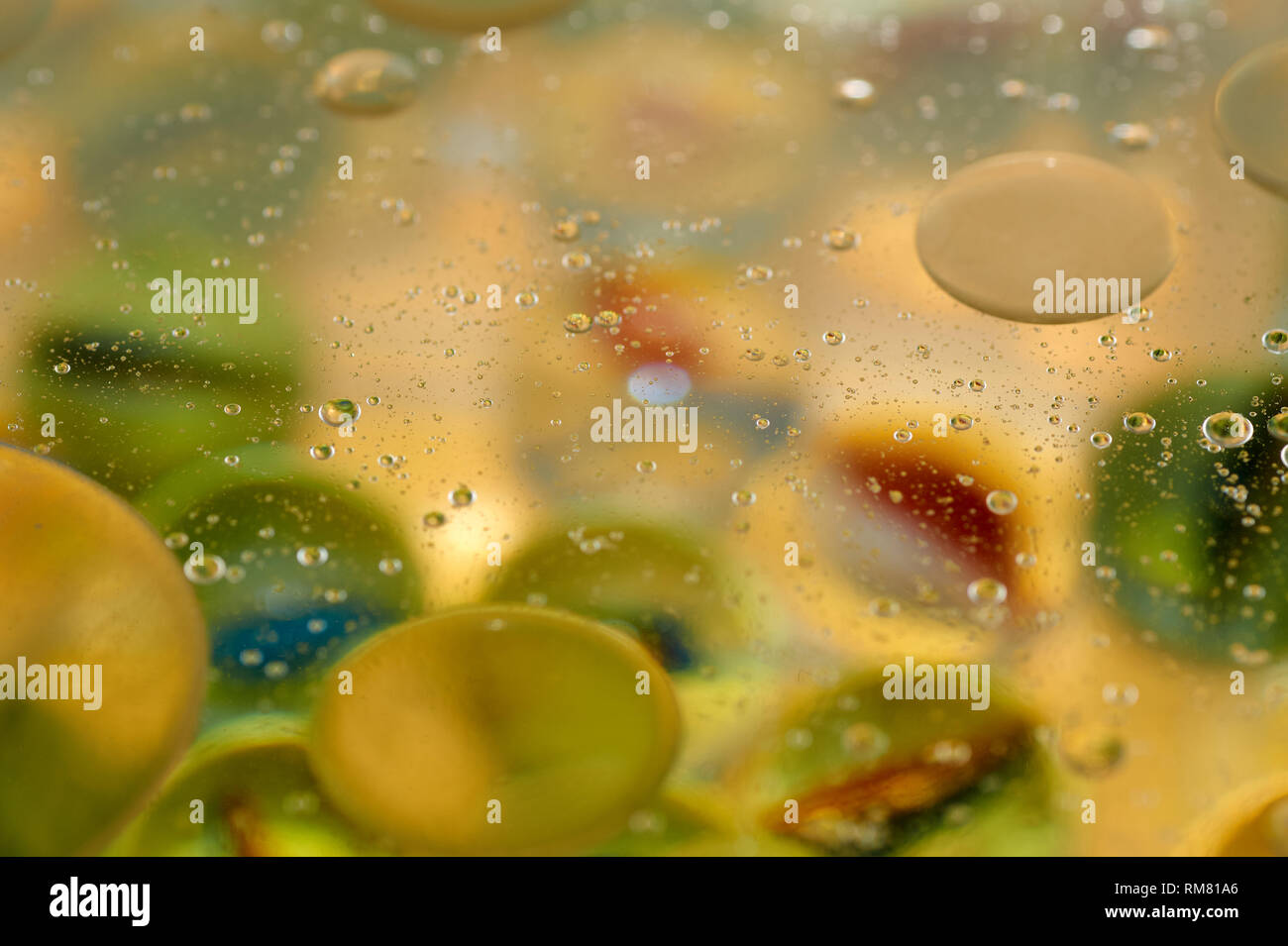 floating in the water abstract colorful, yellow oil drops Stock Photo ...