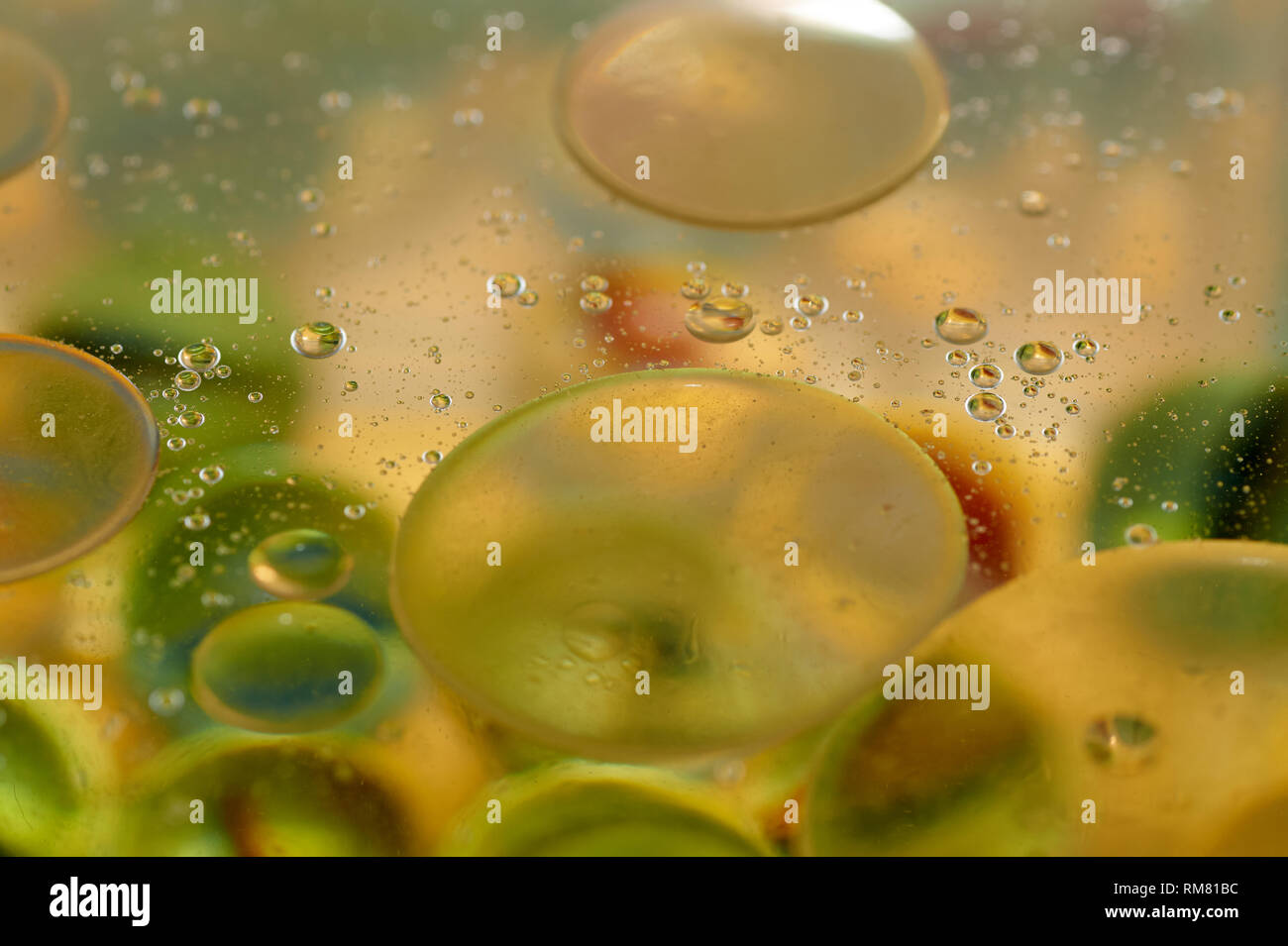 floating in the water abstract colorful, yellow oil drops Stock Photo ...