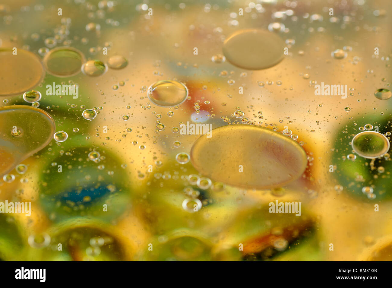 floating in the water abstract colorful, yellow oil drops Stock Photo ...