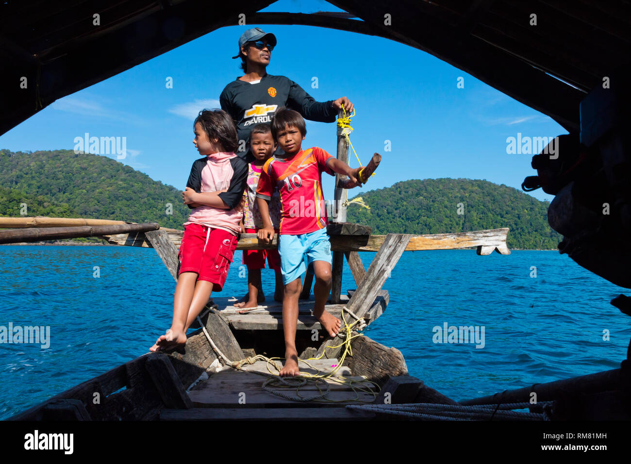 MOKEN people in a traditional boat on KO SURIN THAI ISLAND in MU KO ...