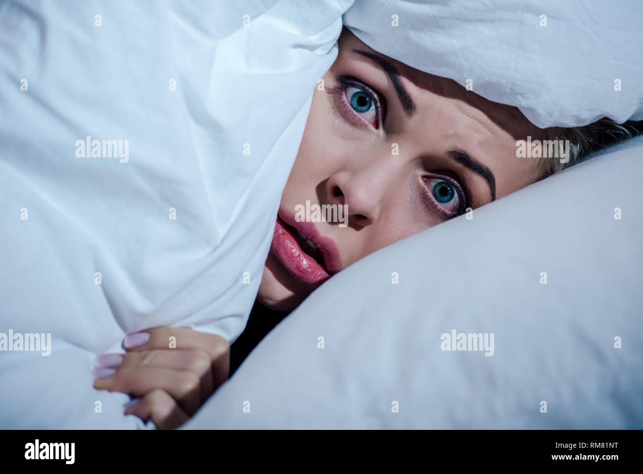 Woman sleeping duvet hiding hi-res stock photography and images - Alamy