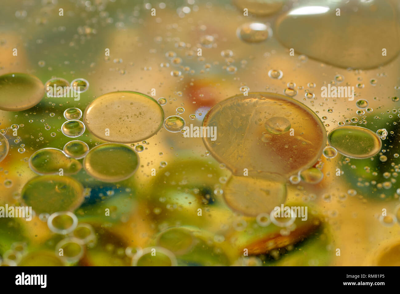 floating in the water abstract colorful, yellow oil drops Stock Photo ...