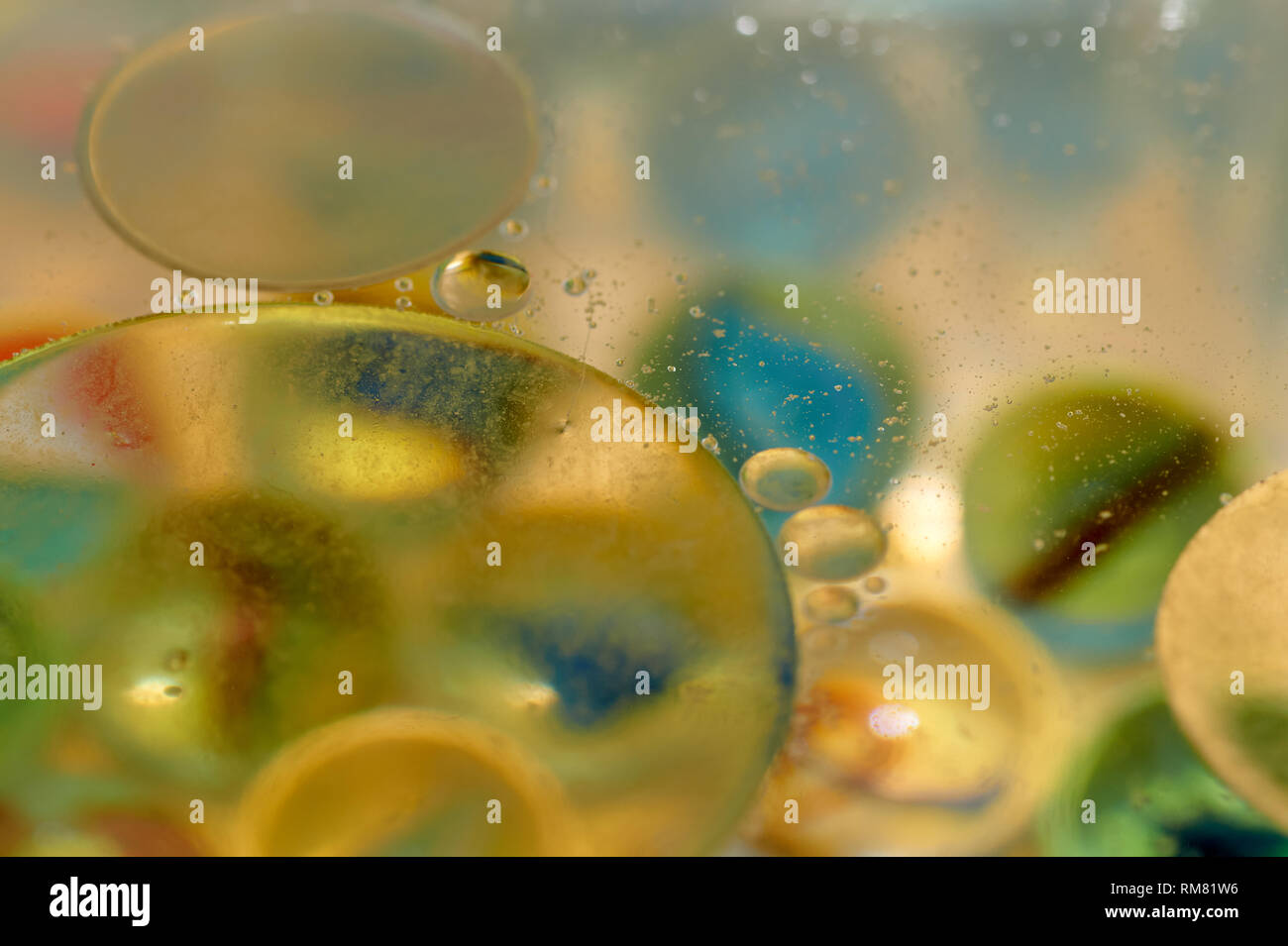 floating in the water abstract colorful, yellow oil drops Stock Photo ...