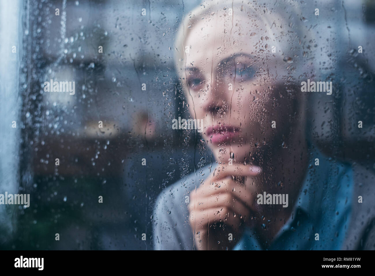 Female touching face sad hi-res stock photography and images - Alamy