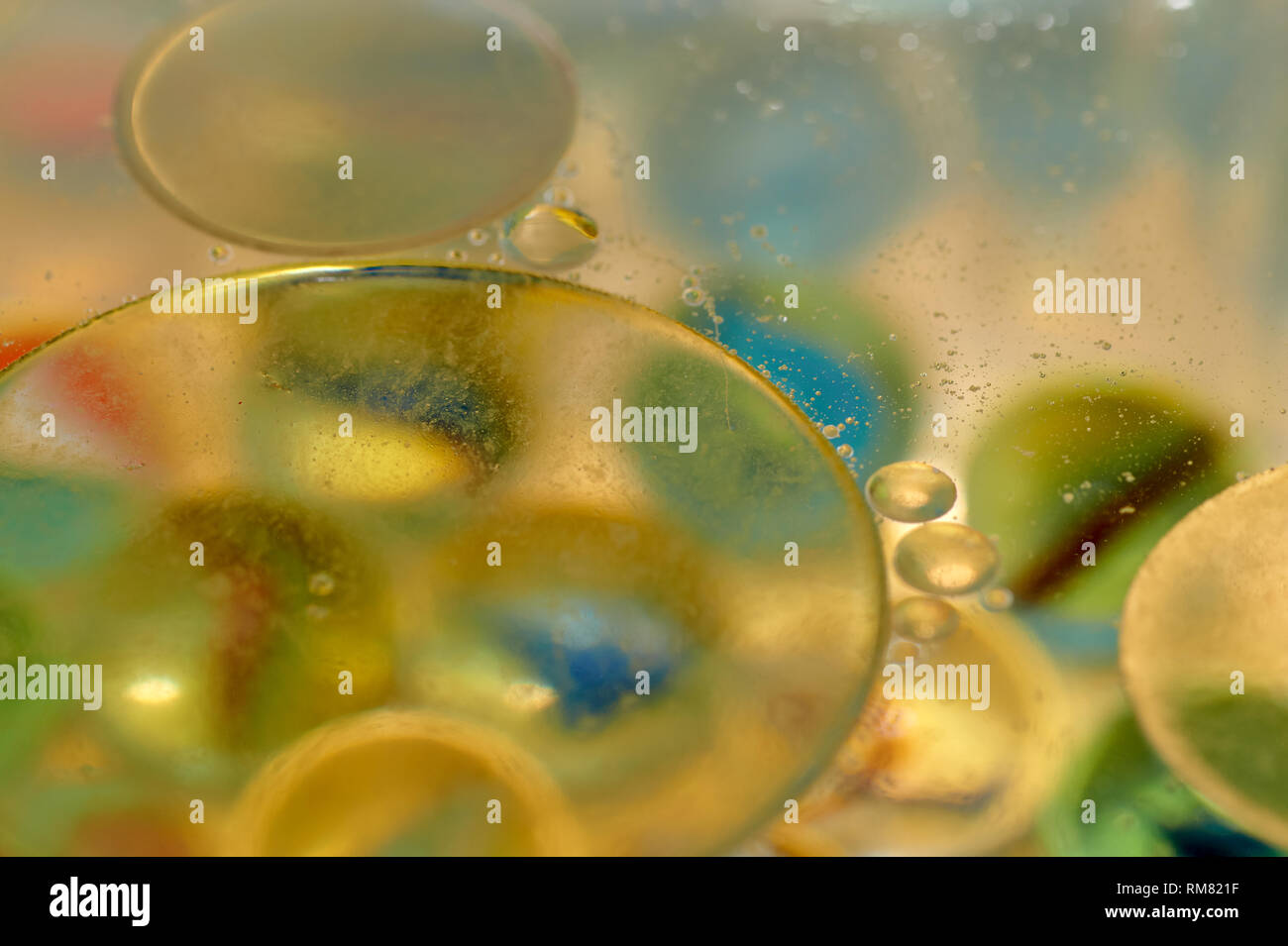 floating in the water abstract colorful, yellow oil drops Stock Photo ...