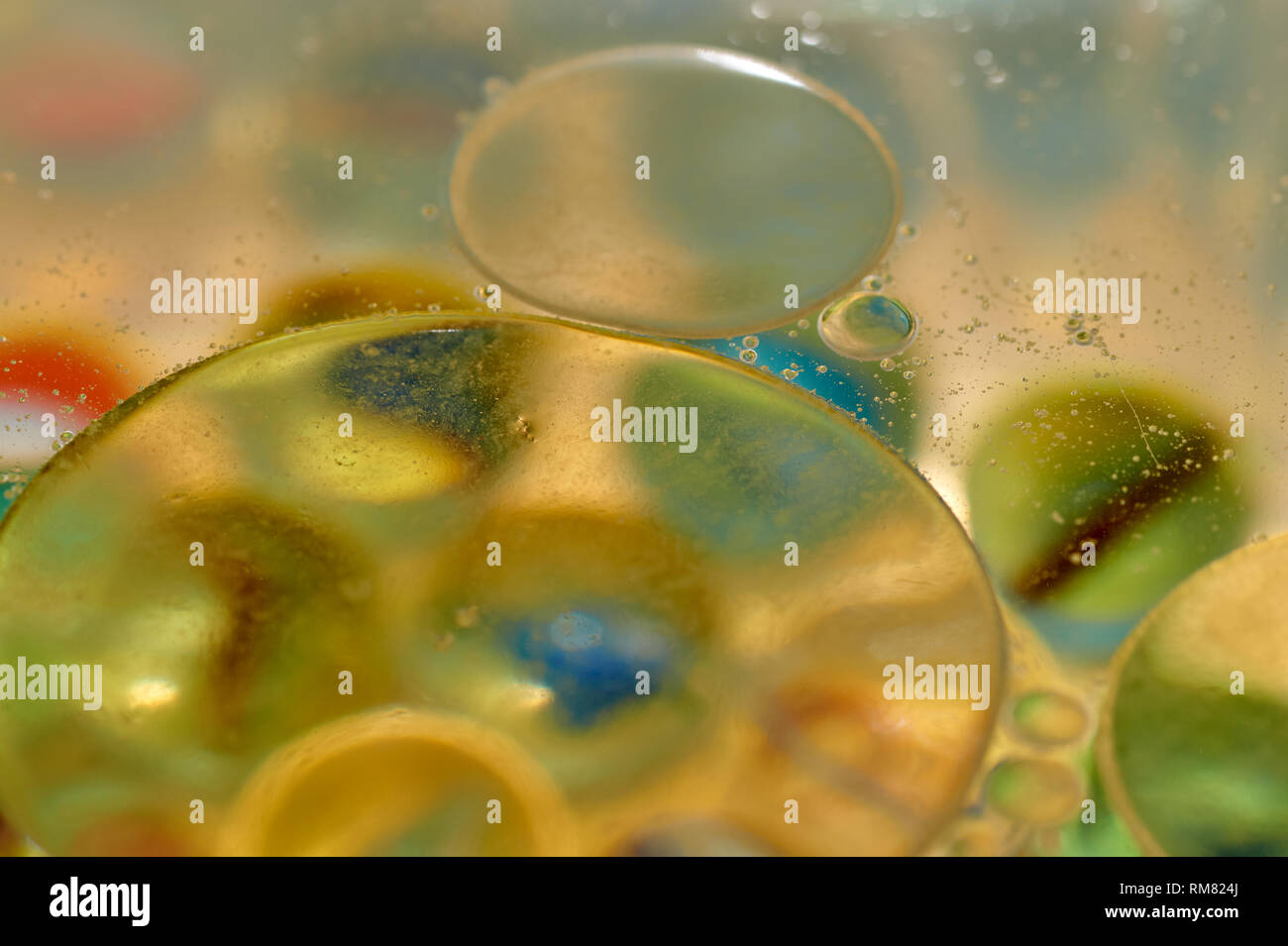 floating in the water abstract colorful, yellow oil drops Stock Photo ...