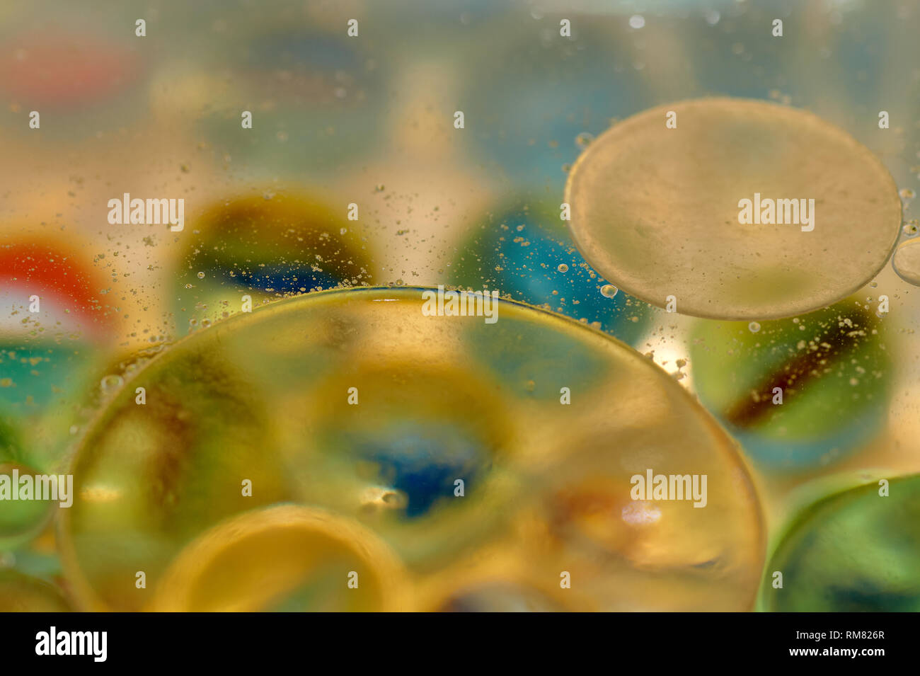 floating in the water abstract colorful, yellow oil drops Stock Photo ...