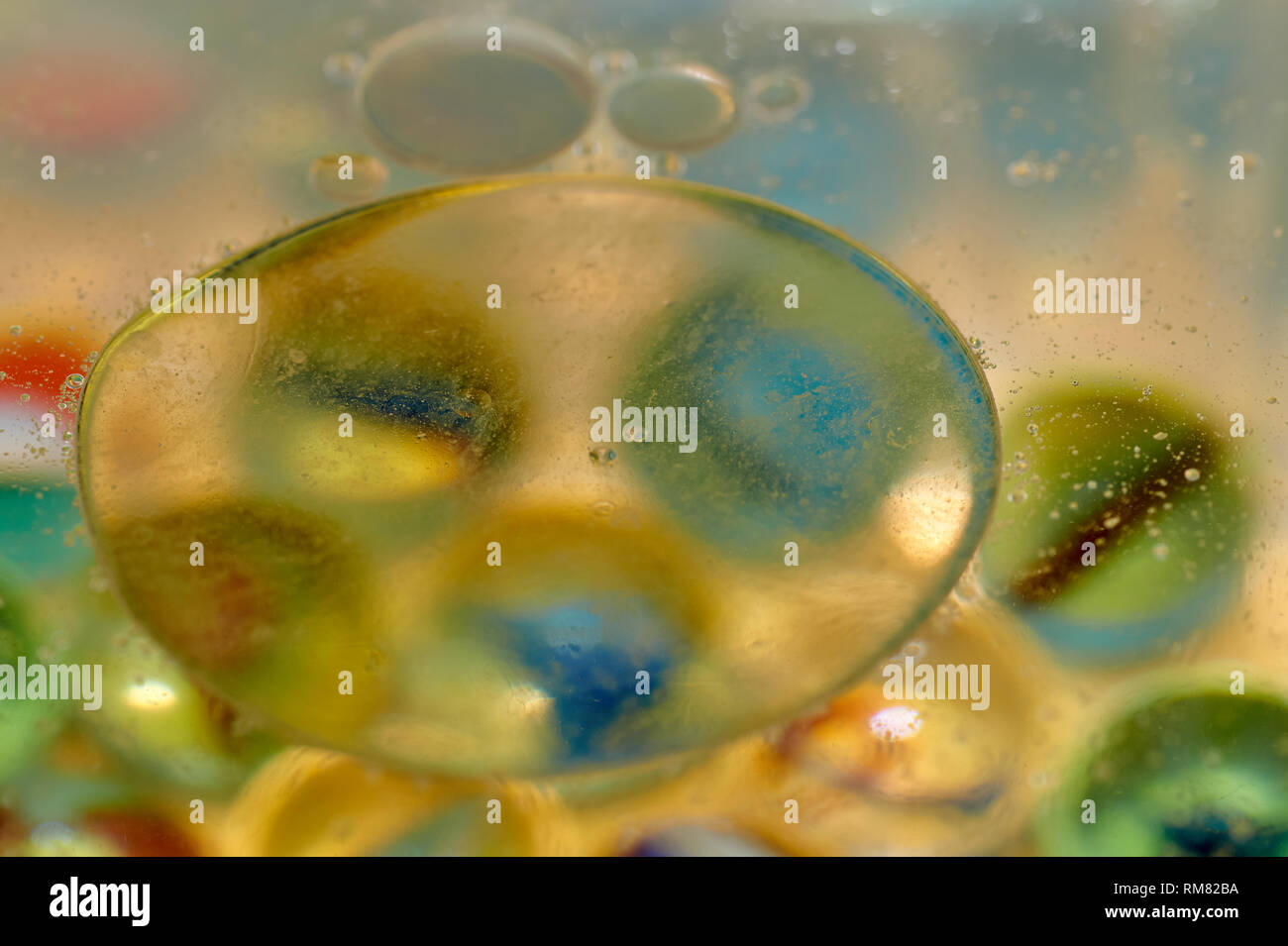 floating in the water abstract colorful, yellow oil drops Stock Photo ...