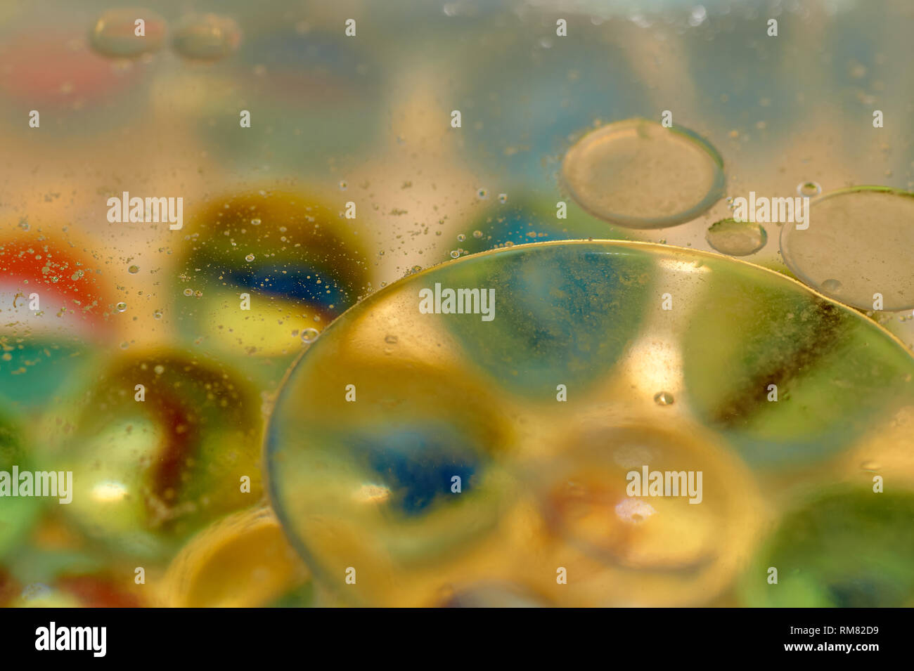 floating in the water abstract colorful, yellow oil drops Stock Photo ...