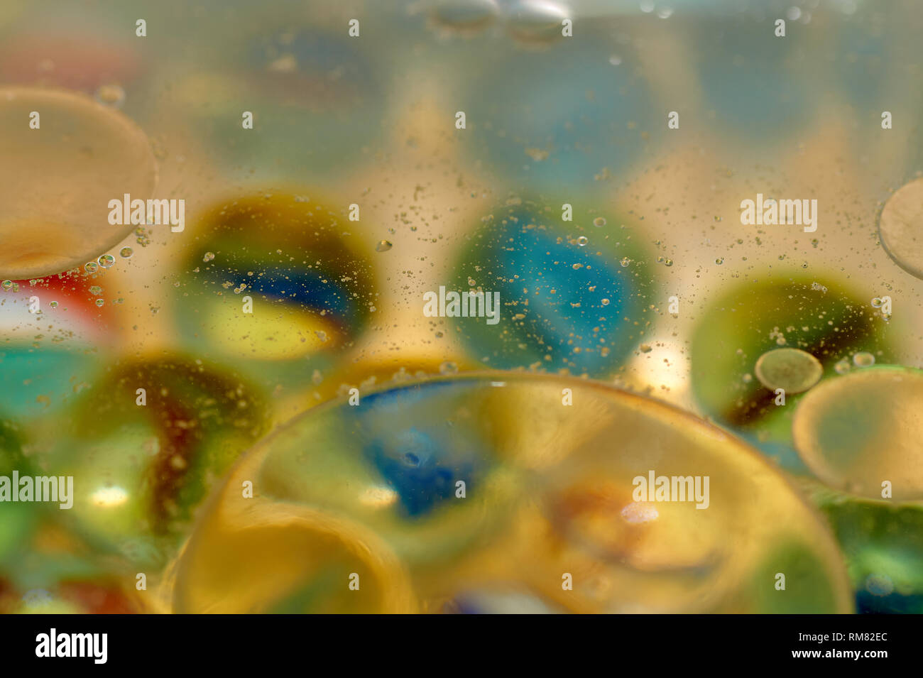 floating in the water abstract colorful, yellow oil drops Stock Photo ...