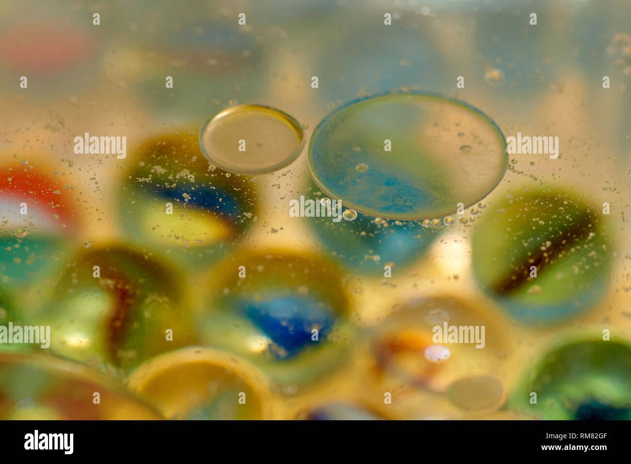 floating in the water abstract colorful, yellow oil drops Stock Photo ...