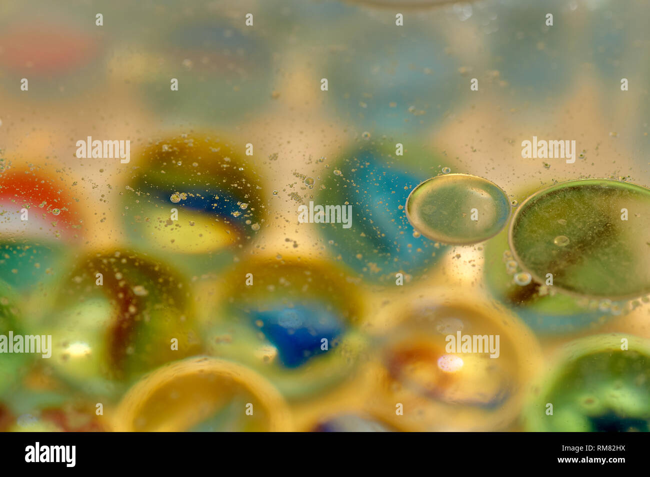floating in the water abstract colorful, yellow oil drops Stock Photo ...