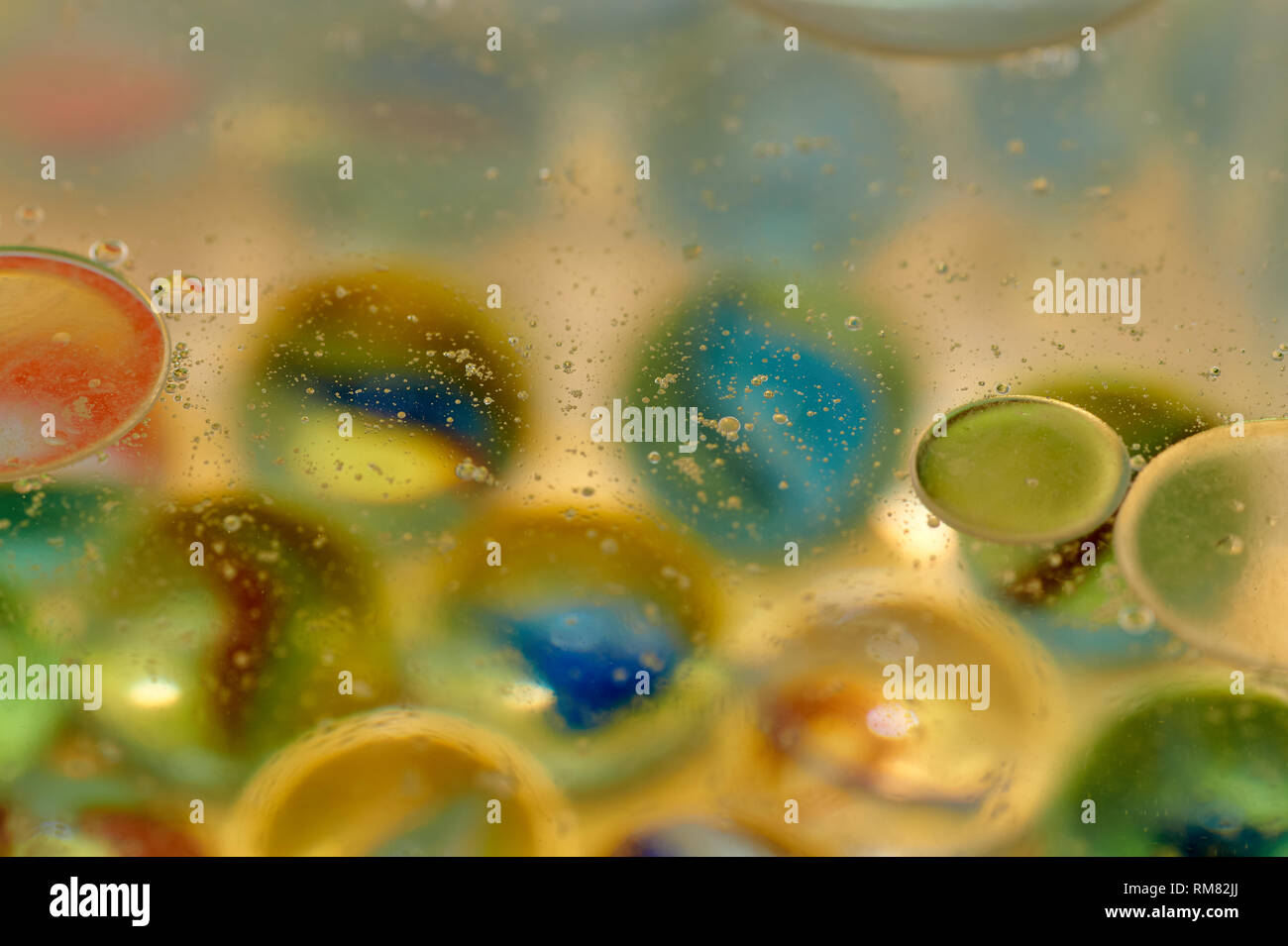 floating in the water abstract colorful, yellow oil drops Stock Photo ...