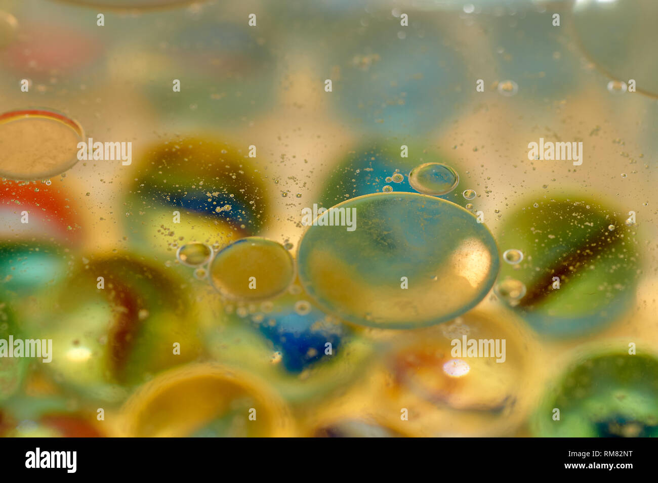 floating in the water abstract colorful, yellow oil drops Stock Photo ...