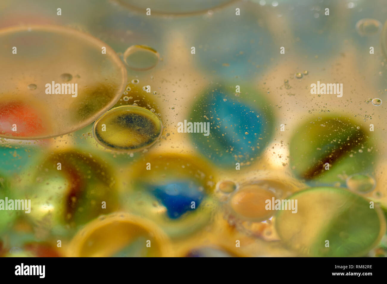 floating in the water abstract colorful, yellow oil drops Stock Photo ...