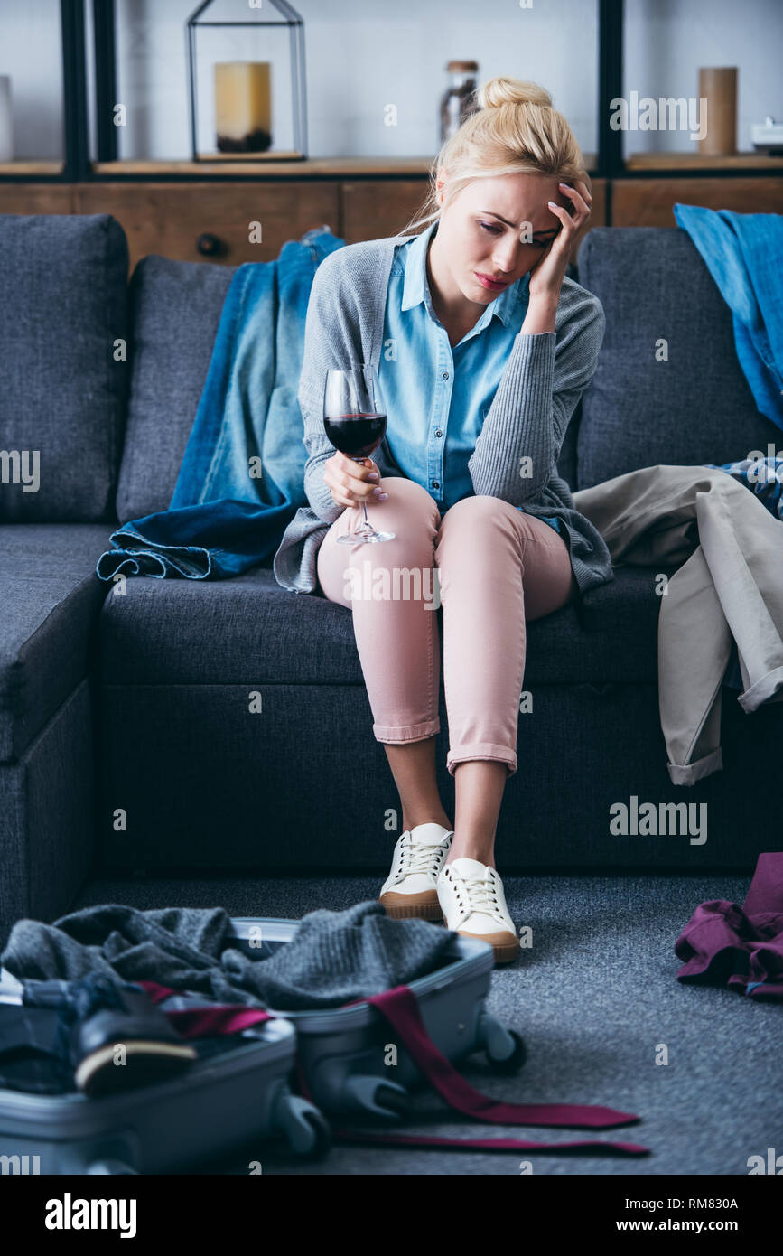 Woman packing suitcase sad hi-res stock photography and images - Alamy