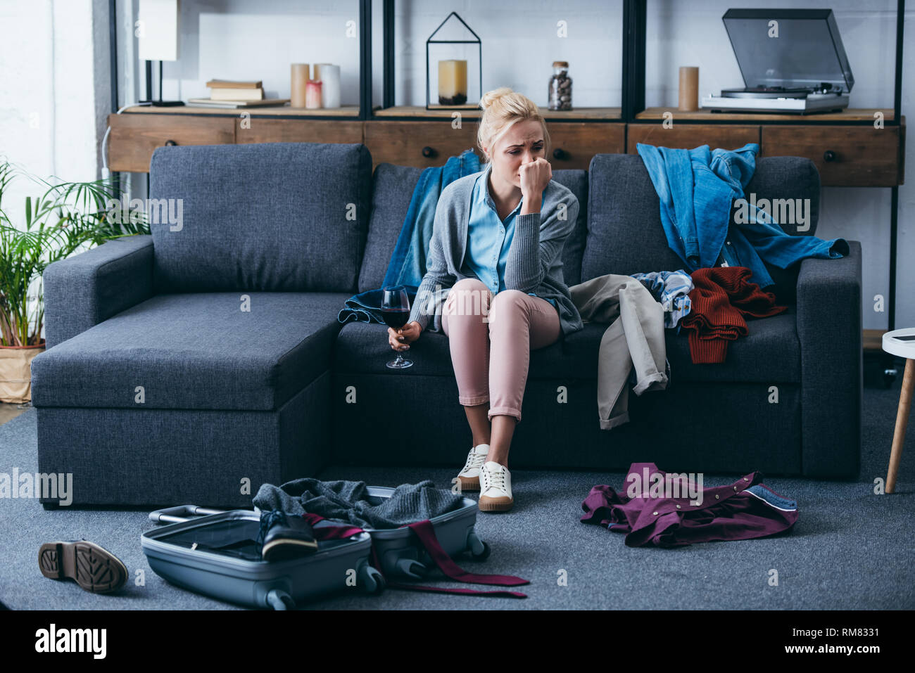 Woman packing suitcase sad hi-res stock photography and images - Alamy