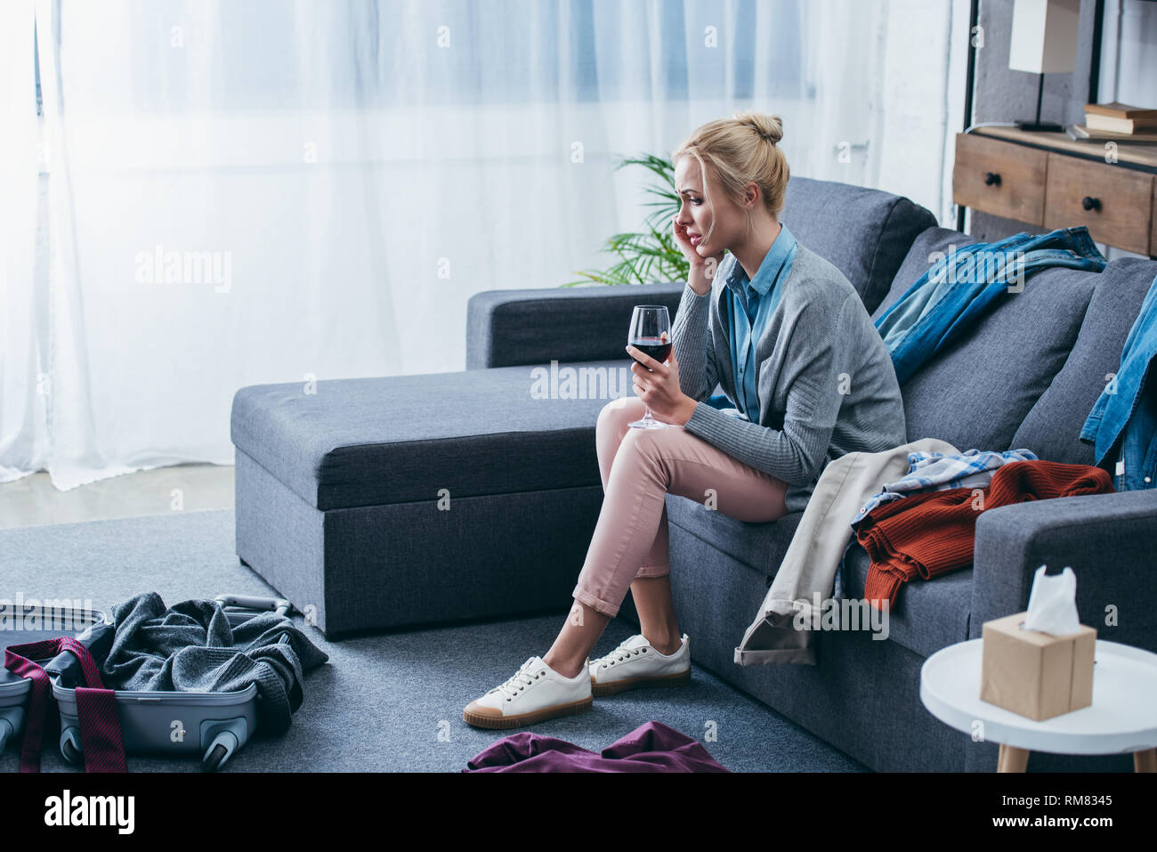 Woman packing suitcase sad hi-res stock photography and images - Alamy
